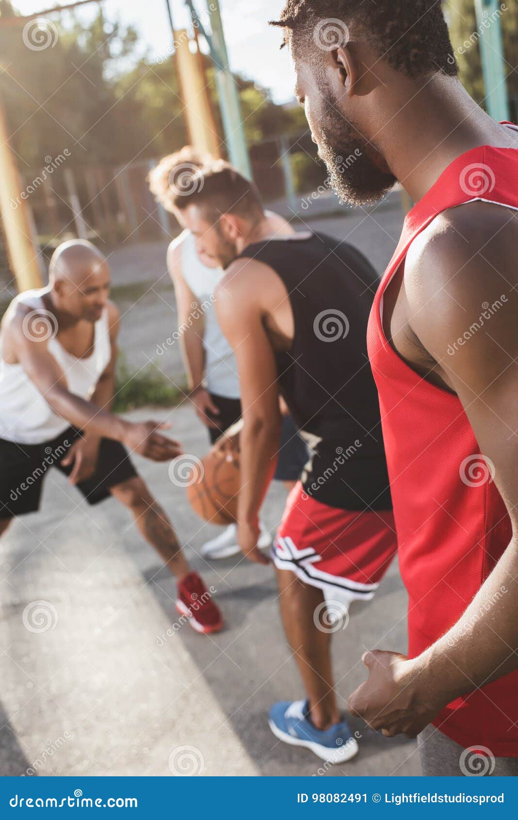 Young Multicultural Men Playing Basketball on Court Stock Image - Image ...