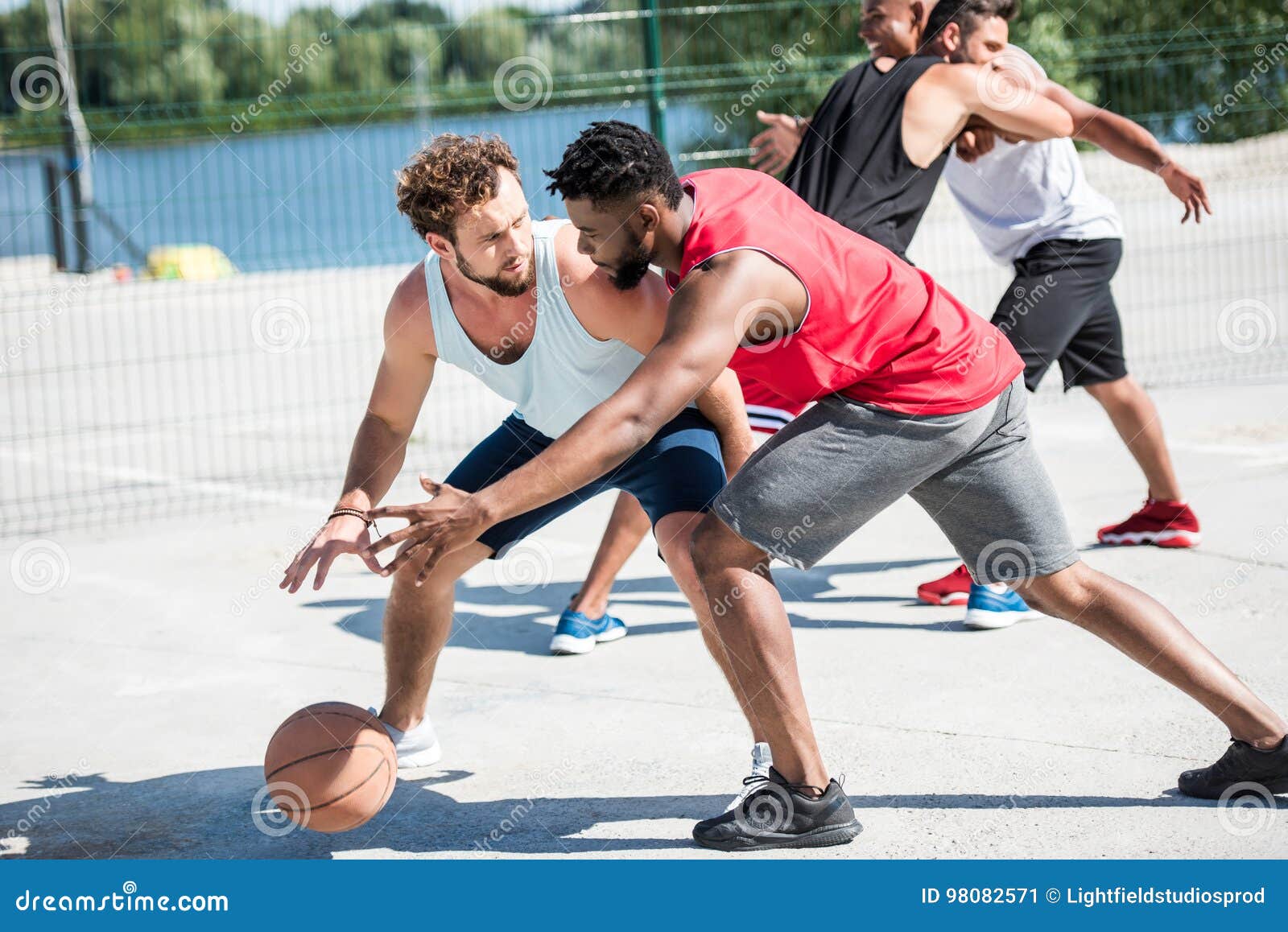 Young Multicultural Men Playing Basketball on Court Stock Image - Image ...