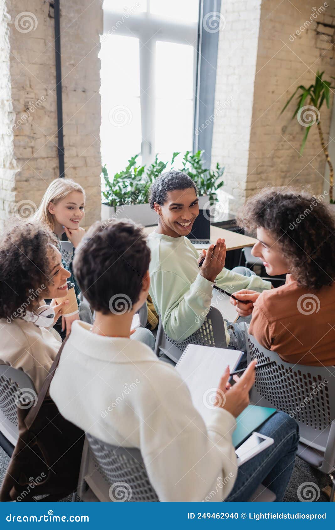 Young Multicultural Students Sitting in Classroom Stock Photo - Image ...