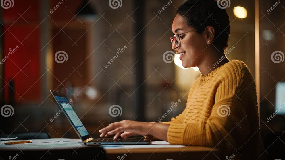 Young Multiethnic Developer Working on a Laptop Computer in Creative ...