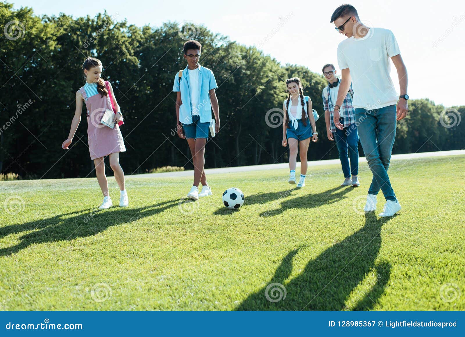 Young Multiethnic Friends Playing with Soccer Ball Stock Image - Image ...