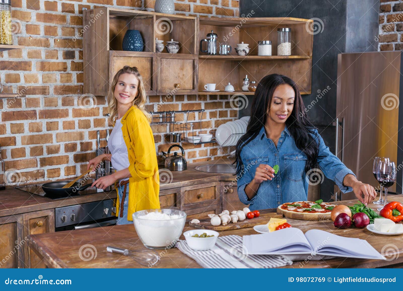 Young Multiethnic Women Cooking Together in Kitchen Stock Image - Image ...