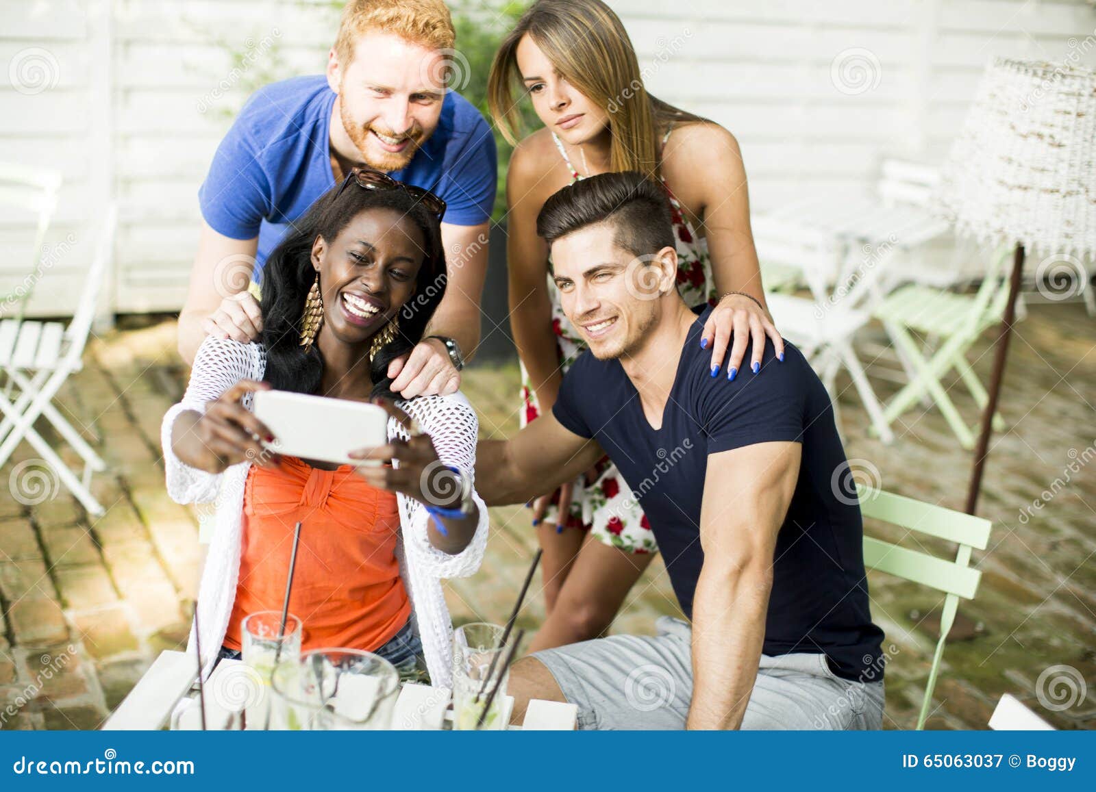 Young multiracial friends stock image. Image of sitting - 65063037