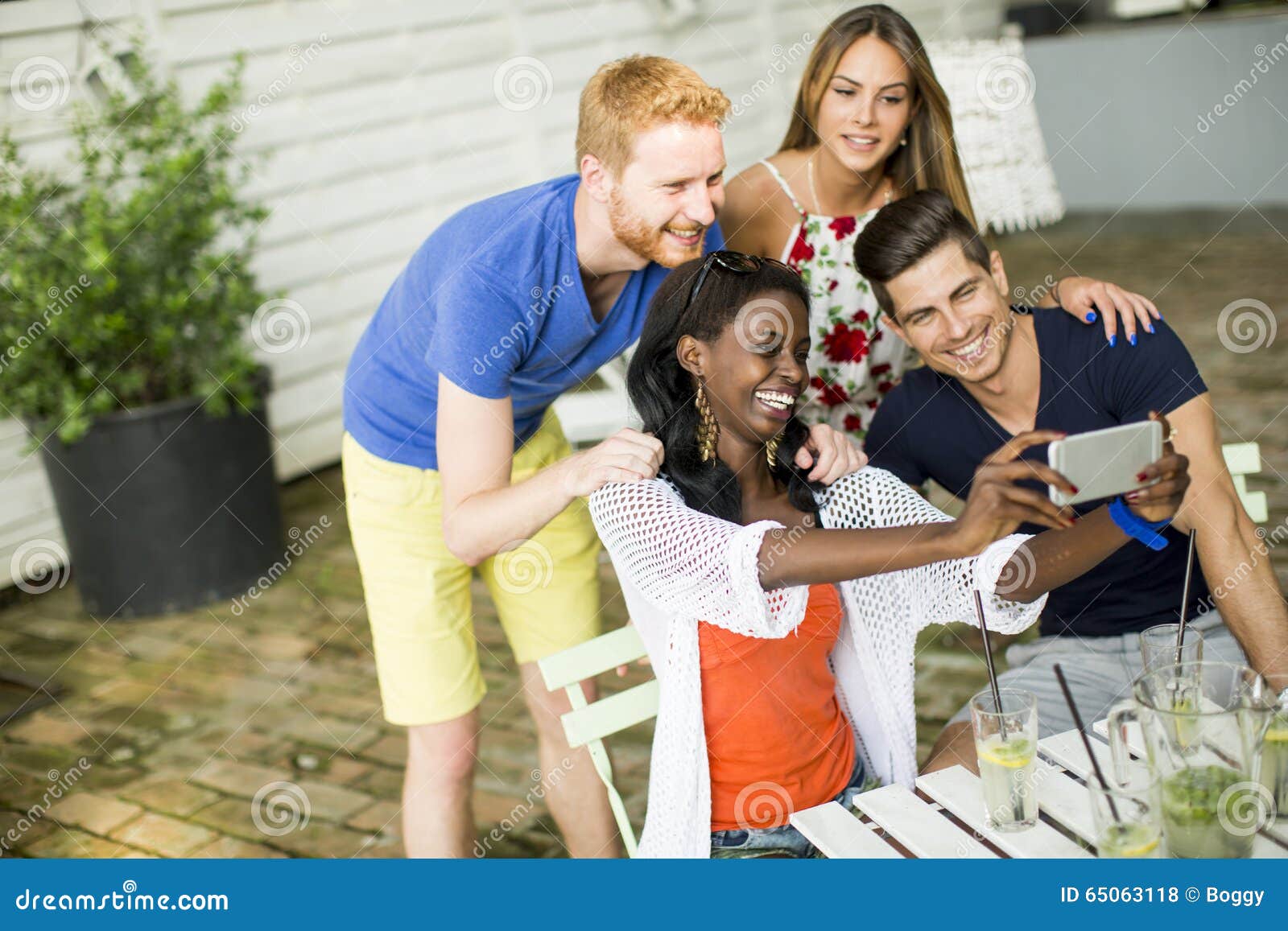 Young multiracial friends stock photo. Image of restaurant - 65063118