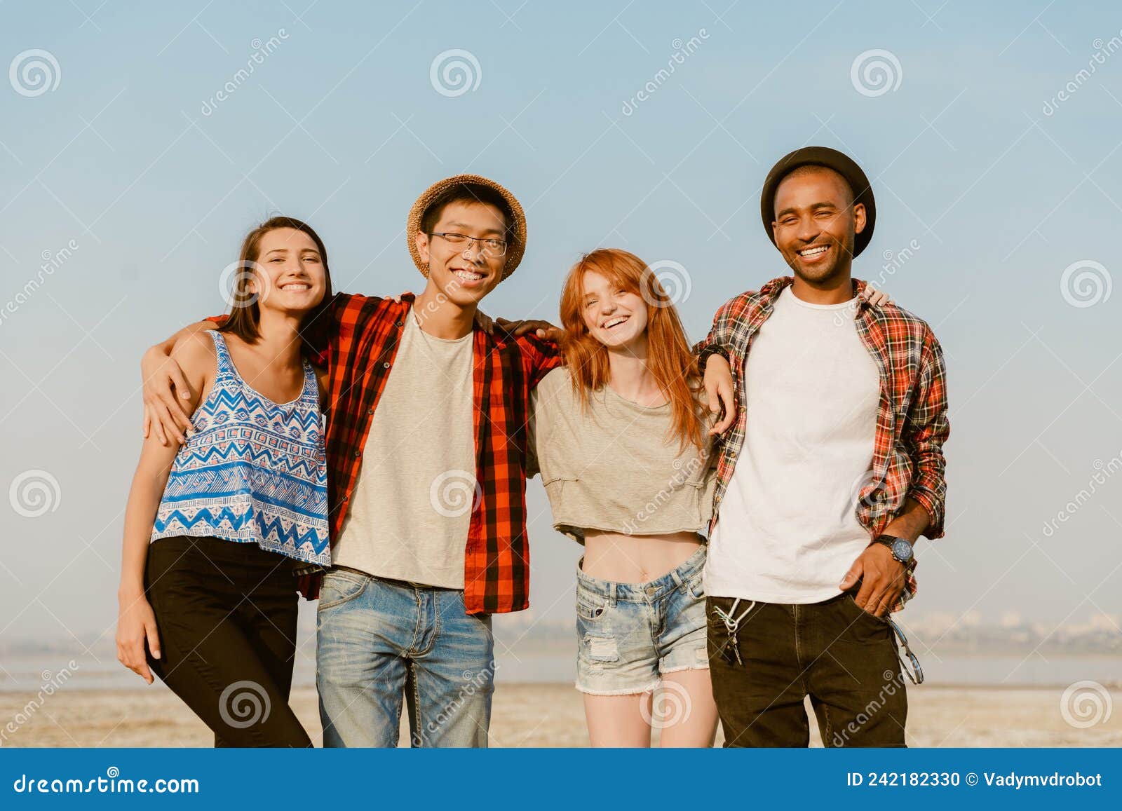Young Multiracial Friends Hugging and Smiling Together Stock Photo ...