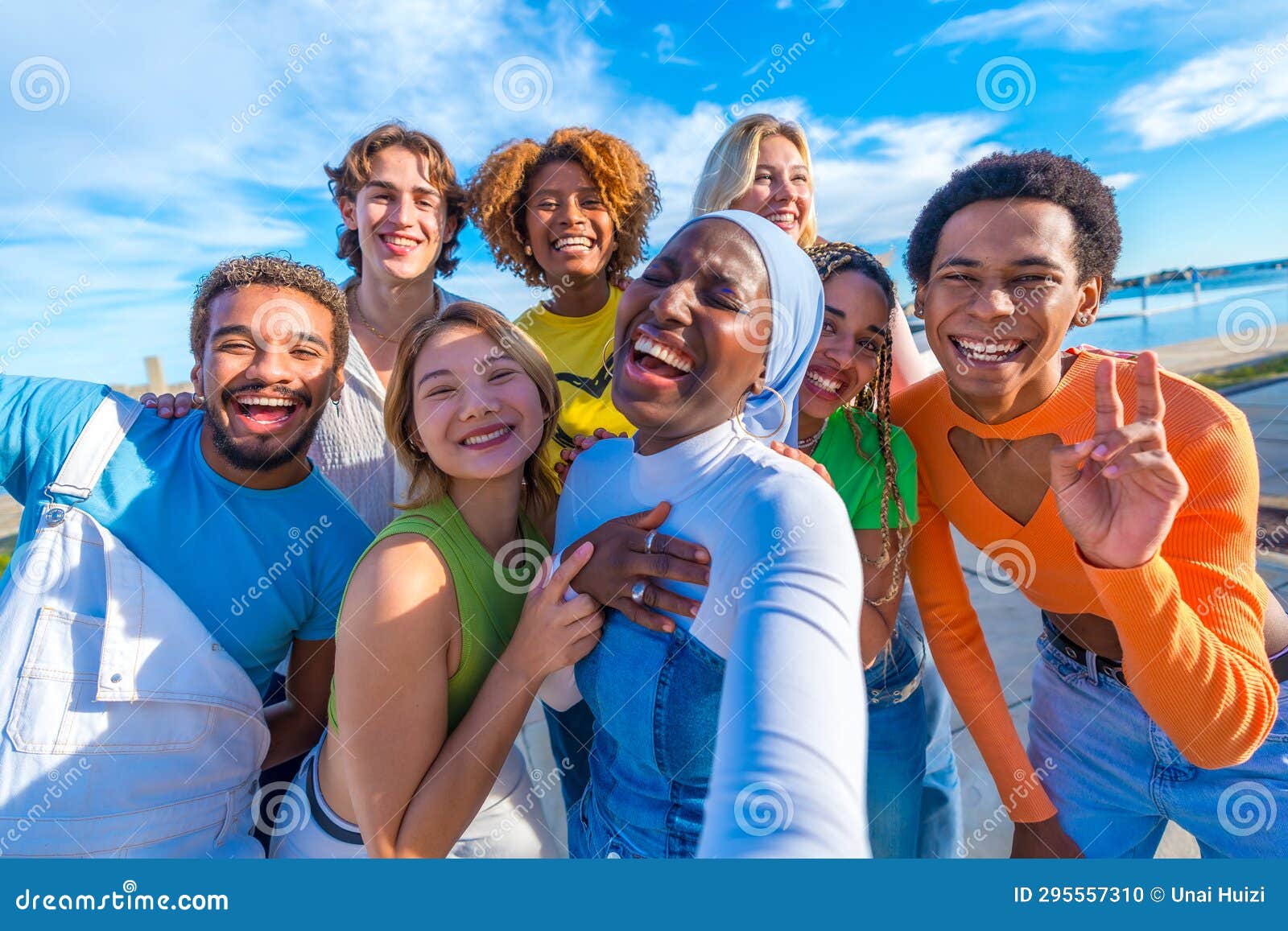 Young Multiracial People Laughing Together while Taking a Selfie Stock ...