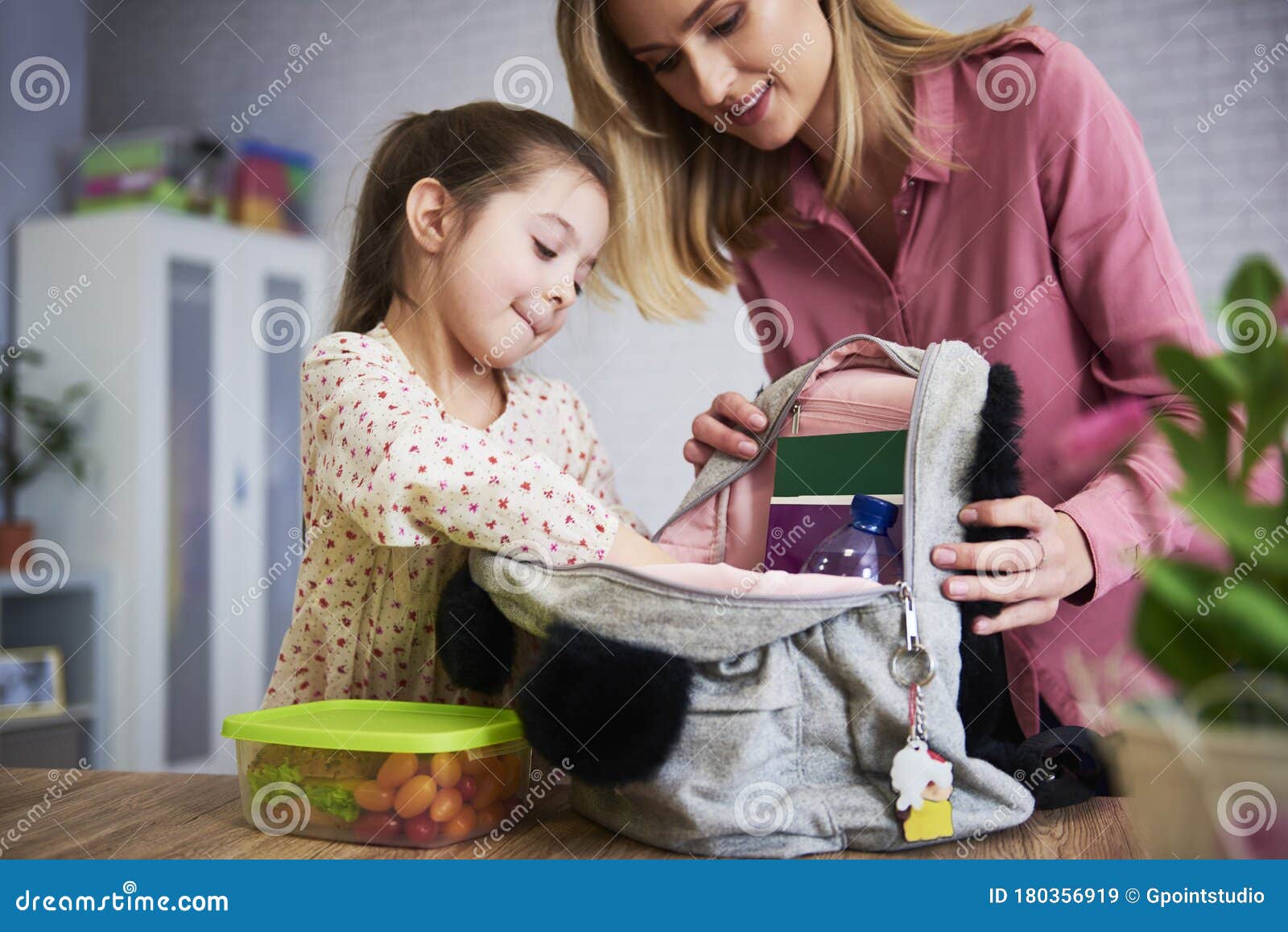 Young Mum and Daughter Packing Backpack for the School Stock Image ...