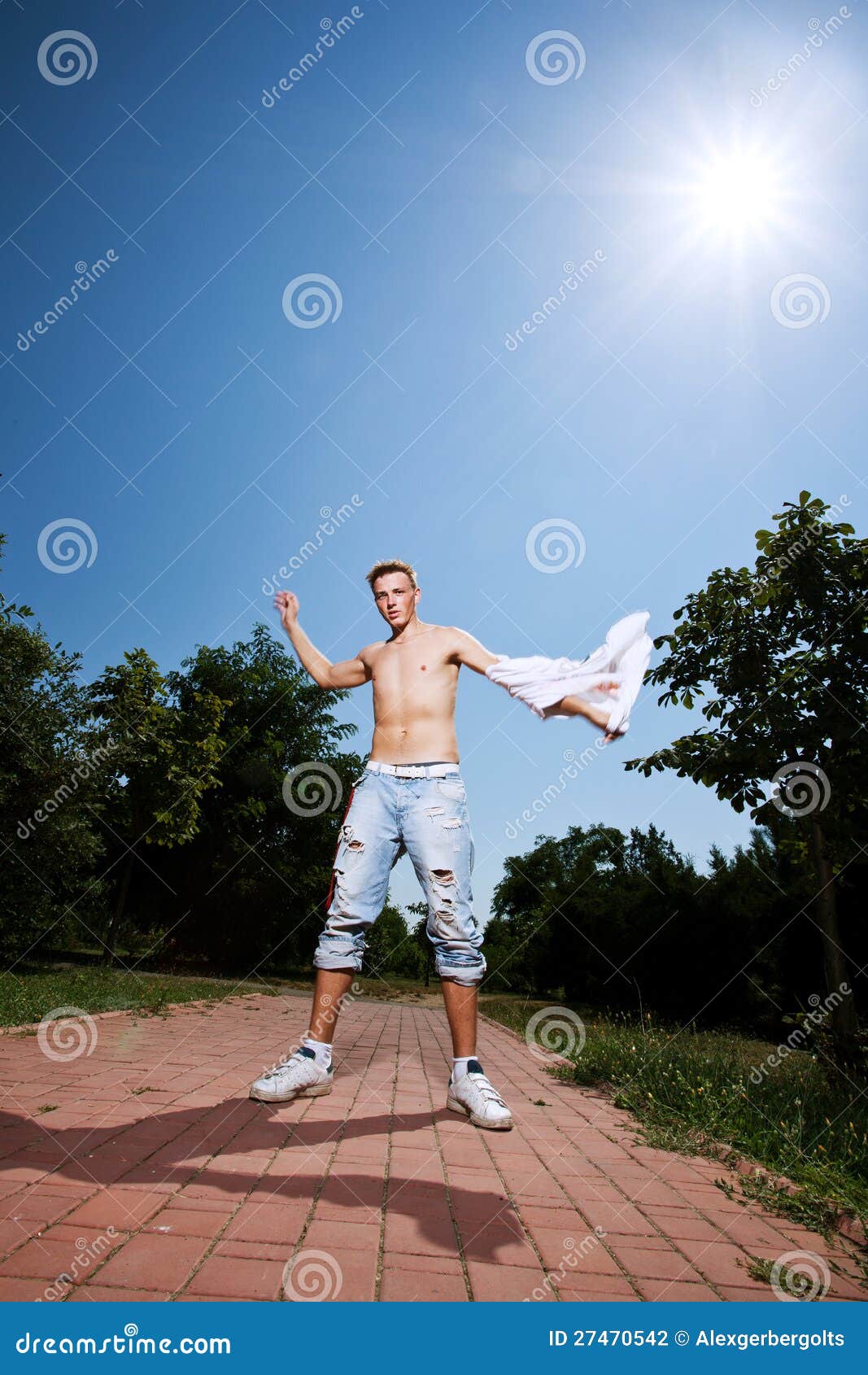 Young Muscular Athlete Taking His Shirt Off Stock Photo - Image of ...