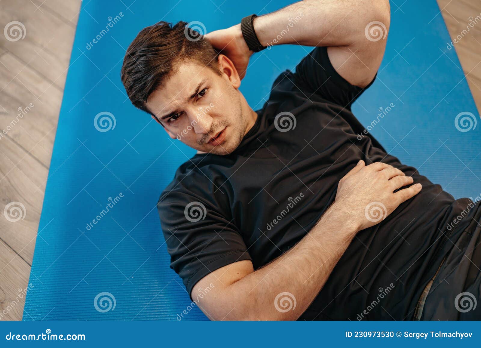 Young Muscular Caucasian Handsome Man Doing Abs Exercises on Mat Stock ...