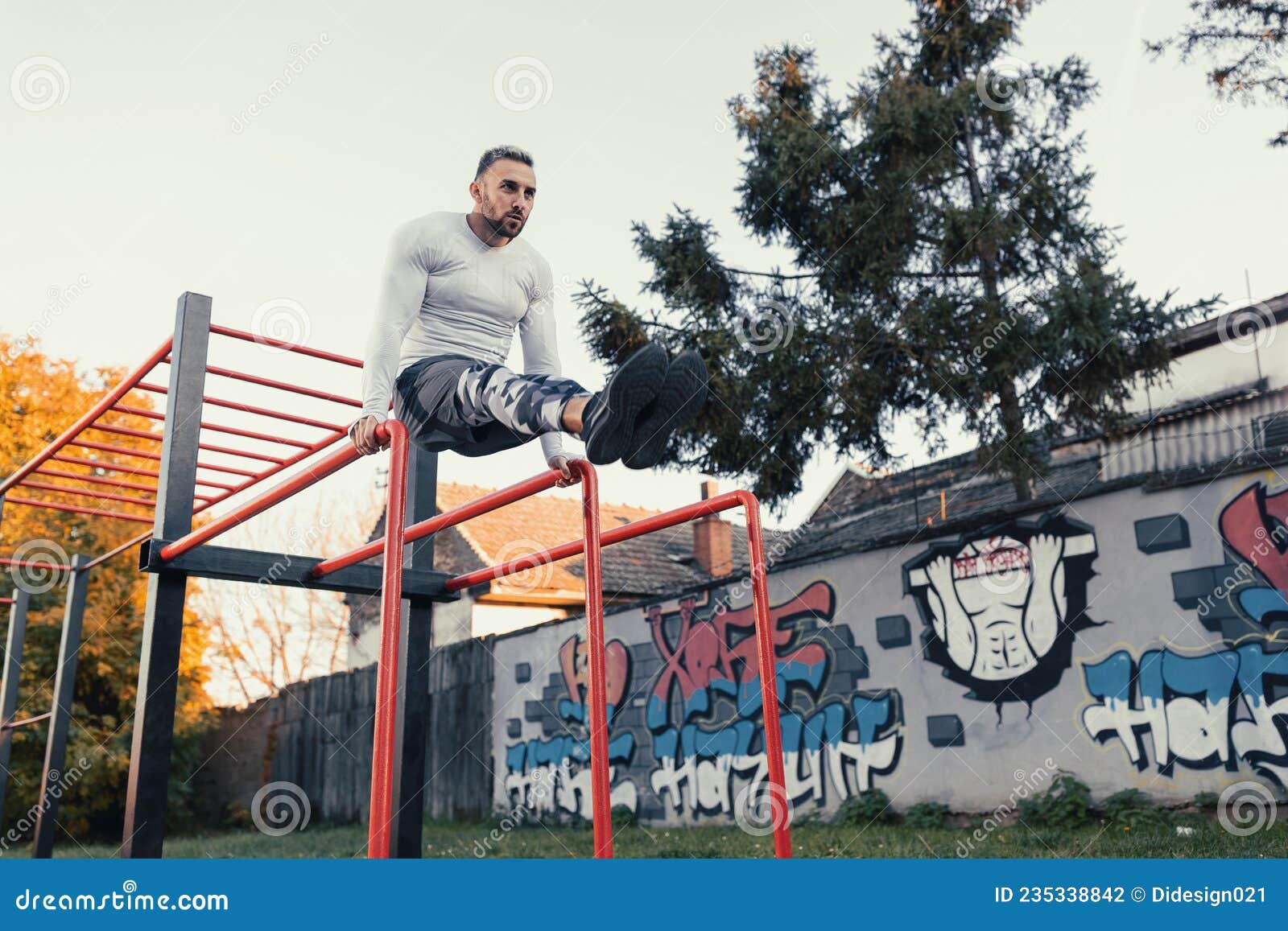 Young Muscular Good Looking Man Working Out on His Abs Using the ...