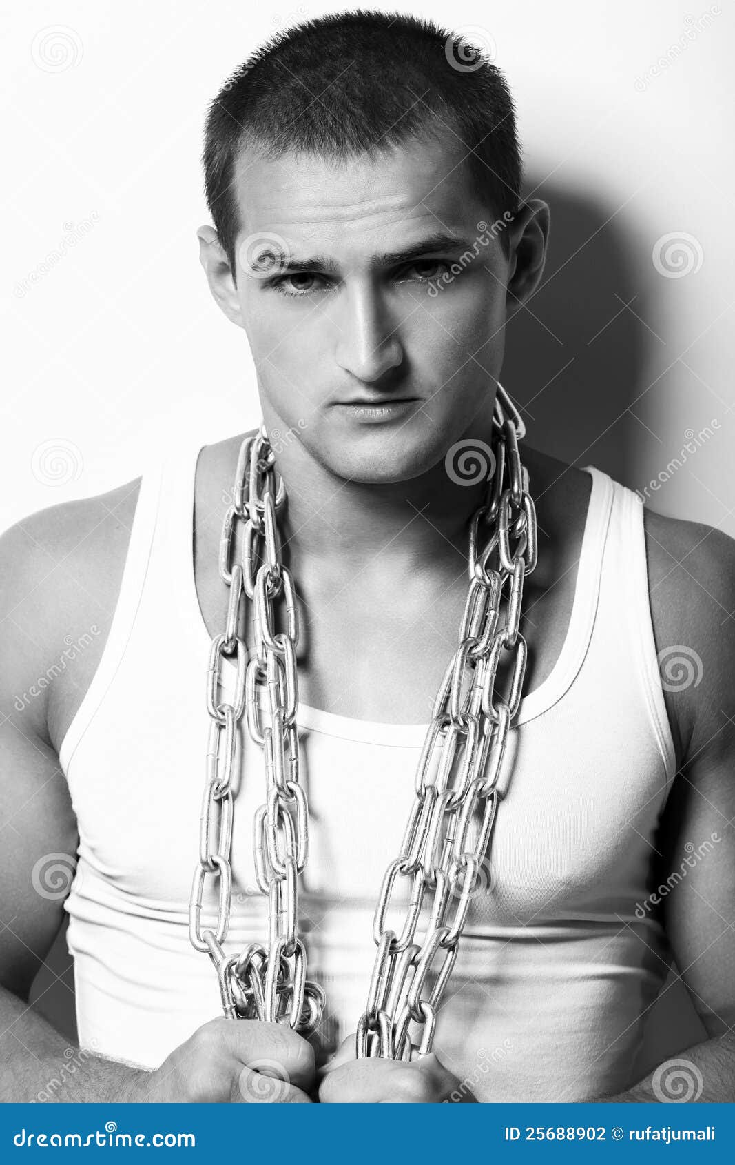 Young Muscular Man with Chains on His Shoulders Stock Photo - Image of ...