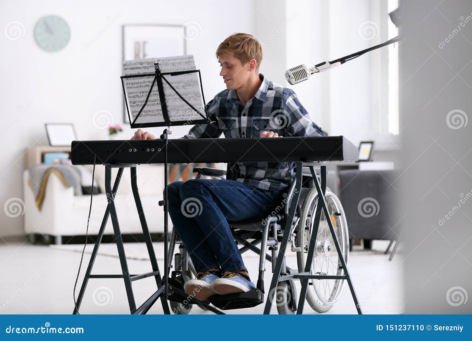 Young Musician in Wheelchair Playing Synthesizer at Home Stock Photo ...
