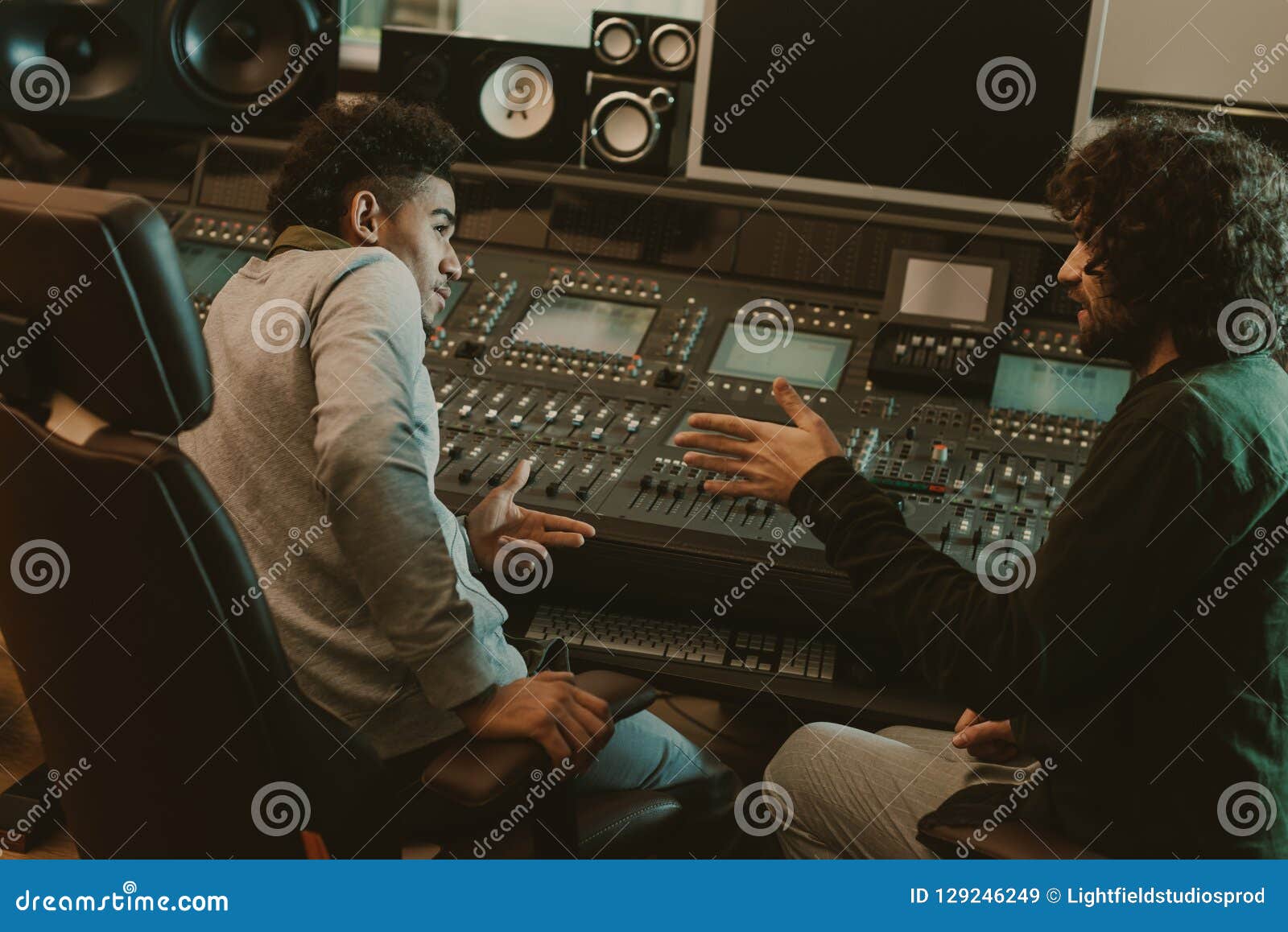 Young musicians talking stock image. Image of professionals - 129246249