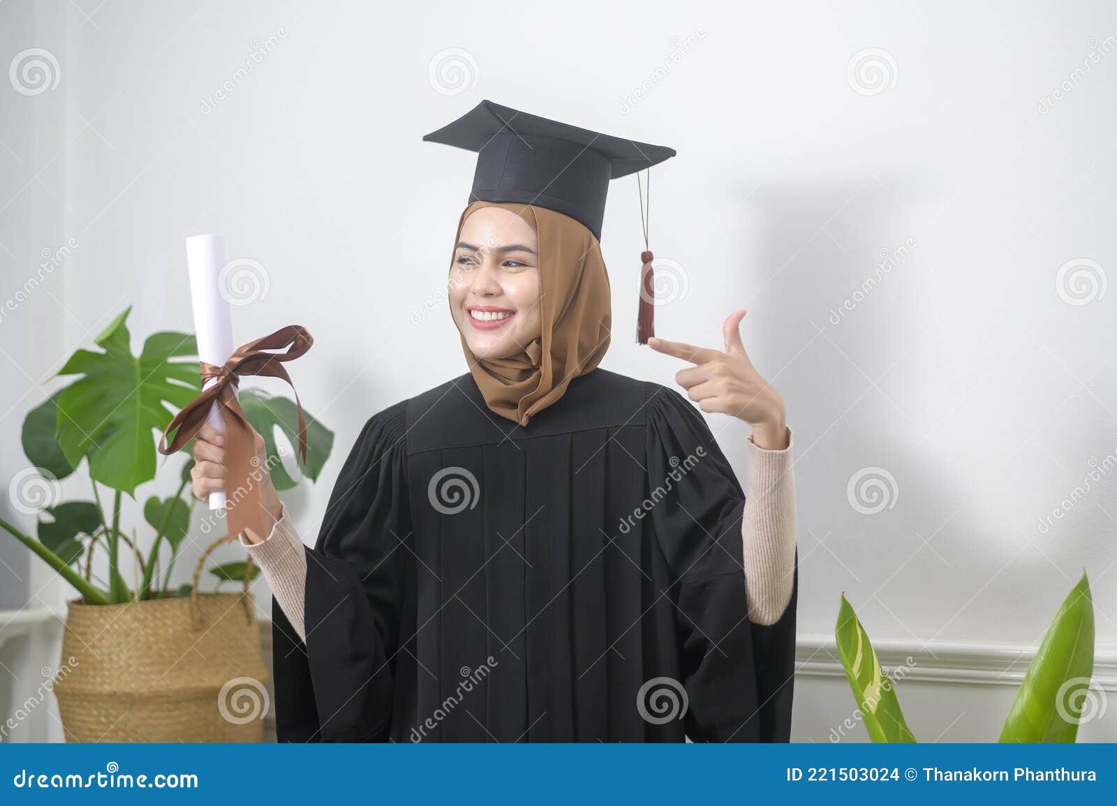 Young Muslim Woman Graduated Holding a Certification Stock Photo ...