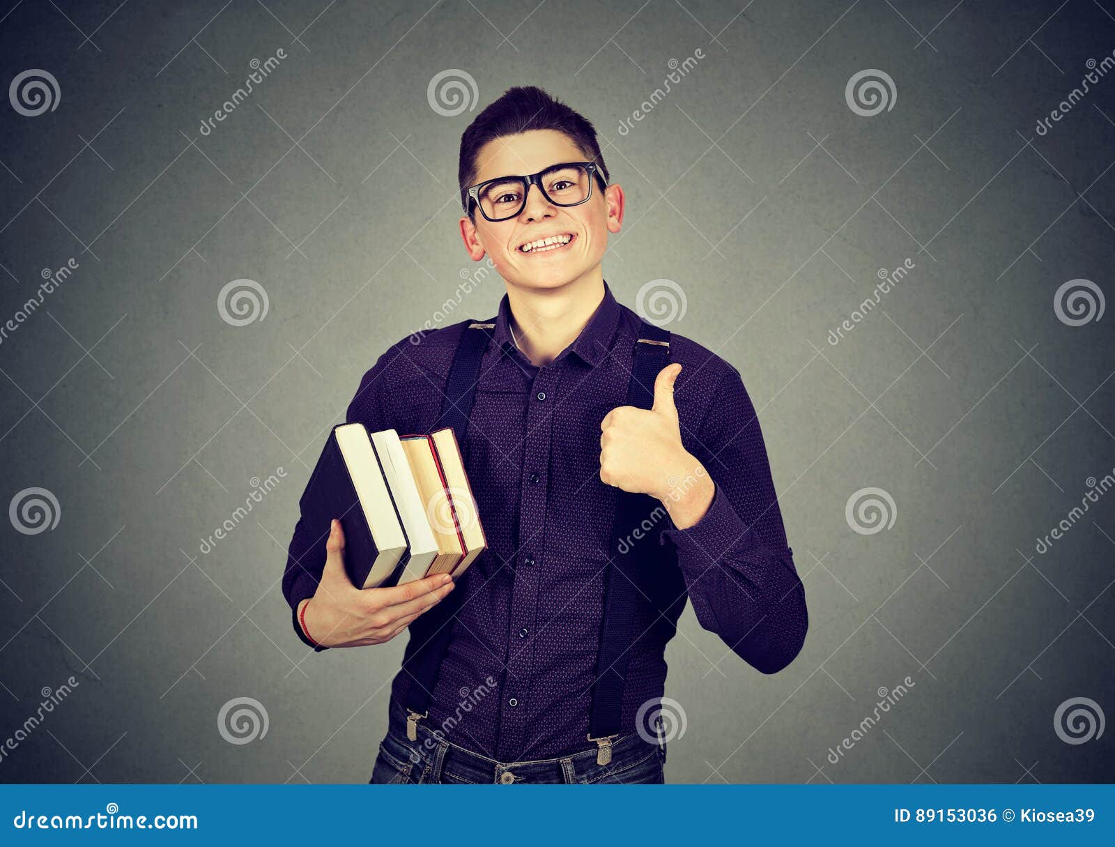 Young Nerd Man in Glasses with Book Showing Thumb Up Stock Photo ...
