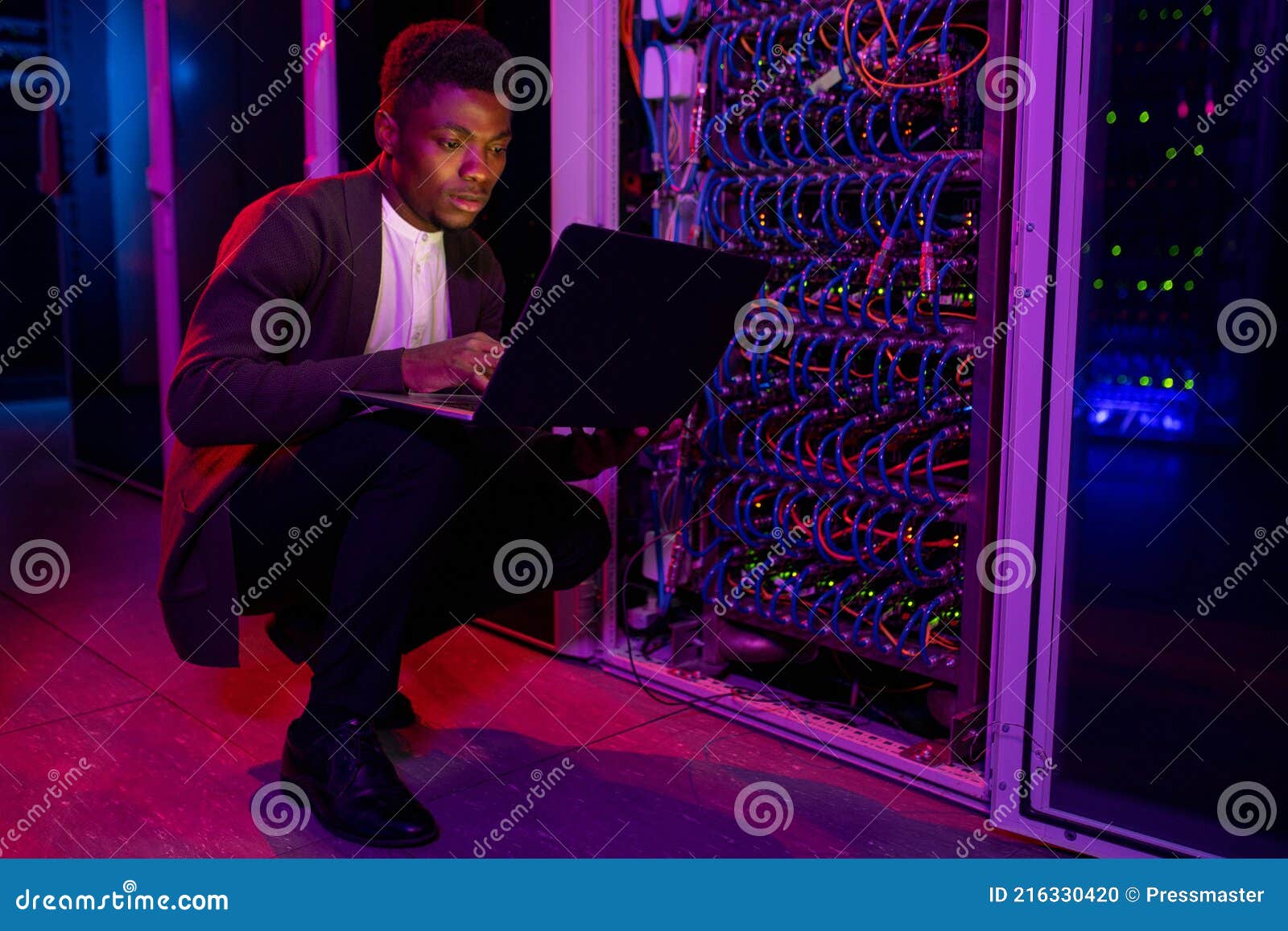 Young Network Engineer Examining Work of Supercomputer Stock Photo ...