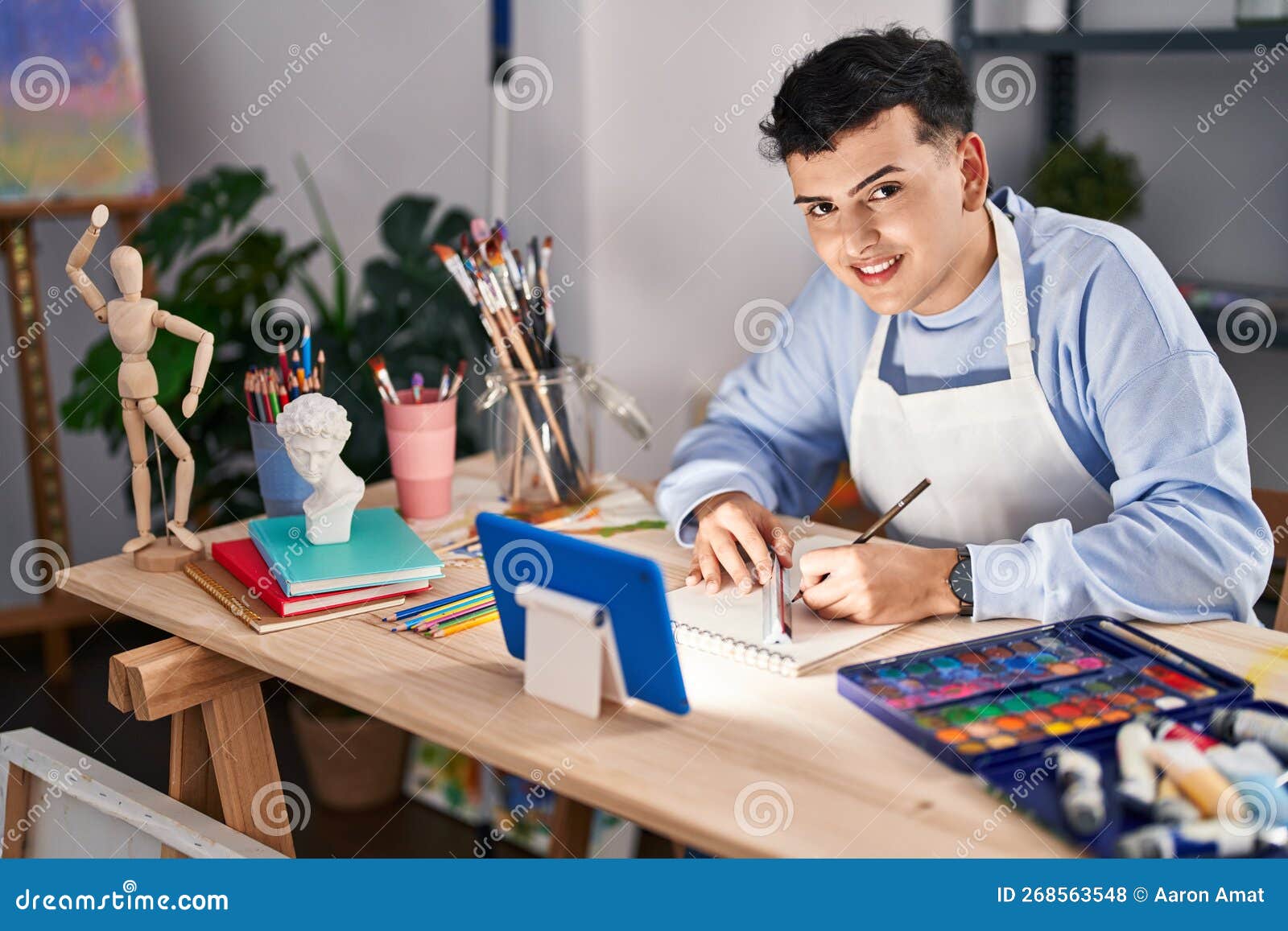 Young Non Binary Man Artist Using Touchpad Drawing on Notebook at Art ...