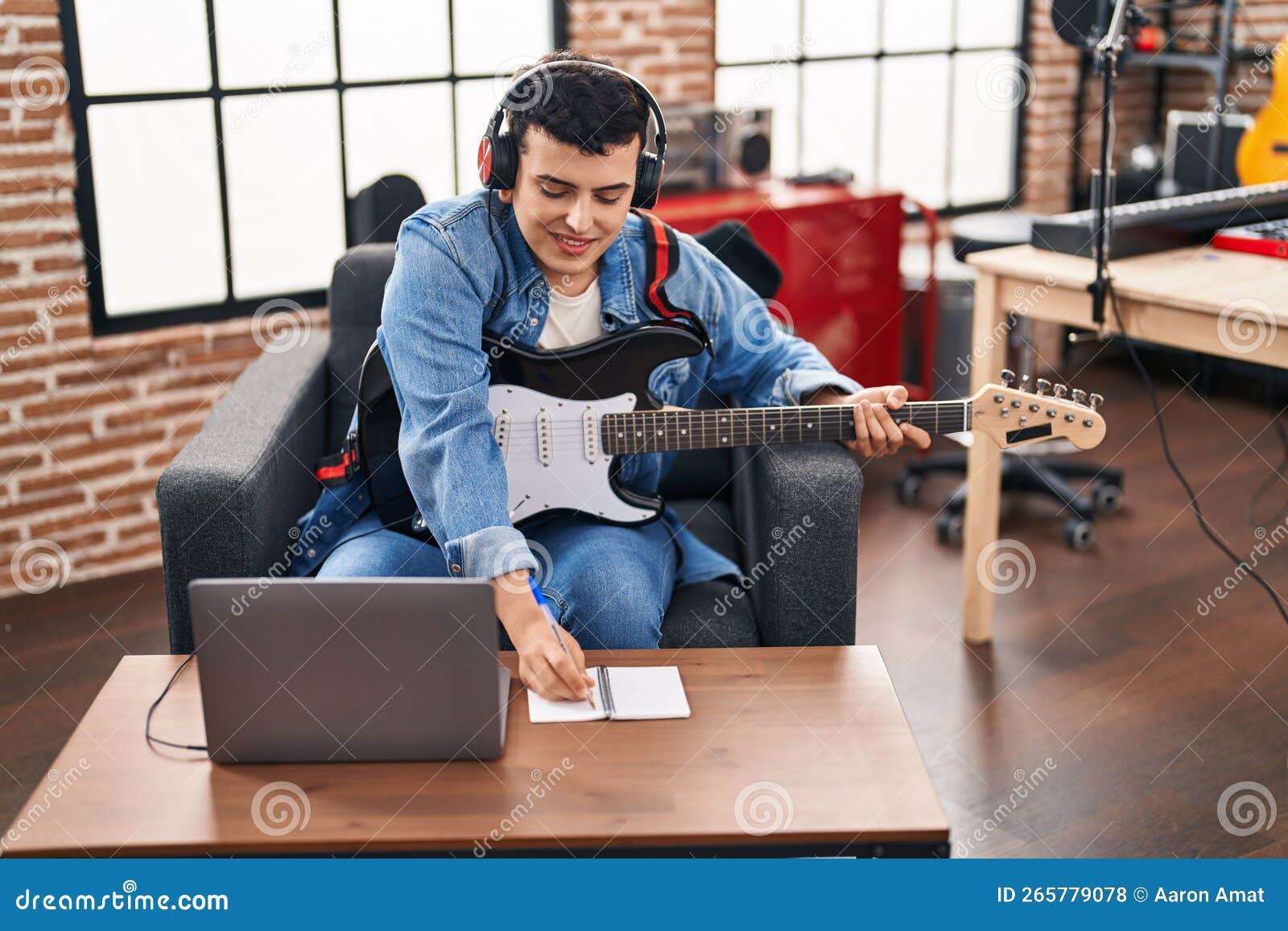 Young Non Binary Man Musician Composing Song Playing Electrical Guitar ... Young Non Binary Man Musician Composing Song Playing Electrical Guitar ...