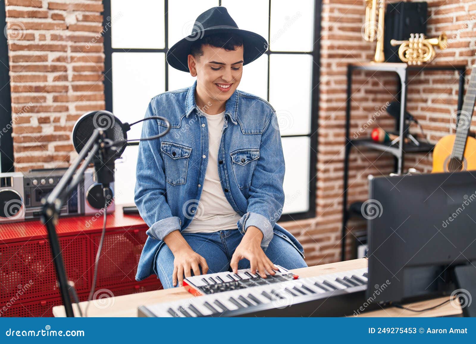 Young Non Binary Man Musician Playing Piano Keyboard at Music Studio ...