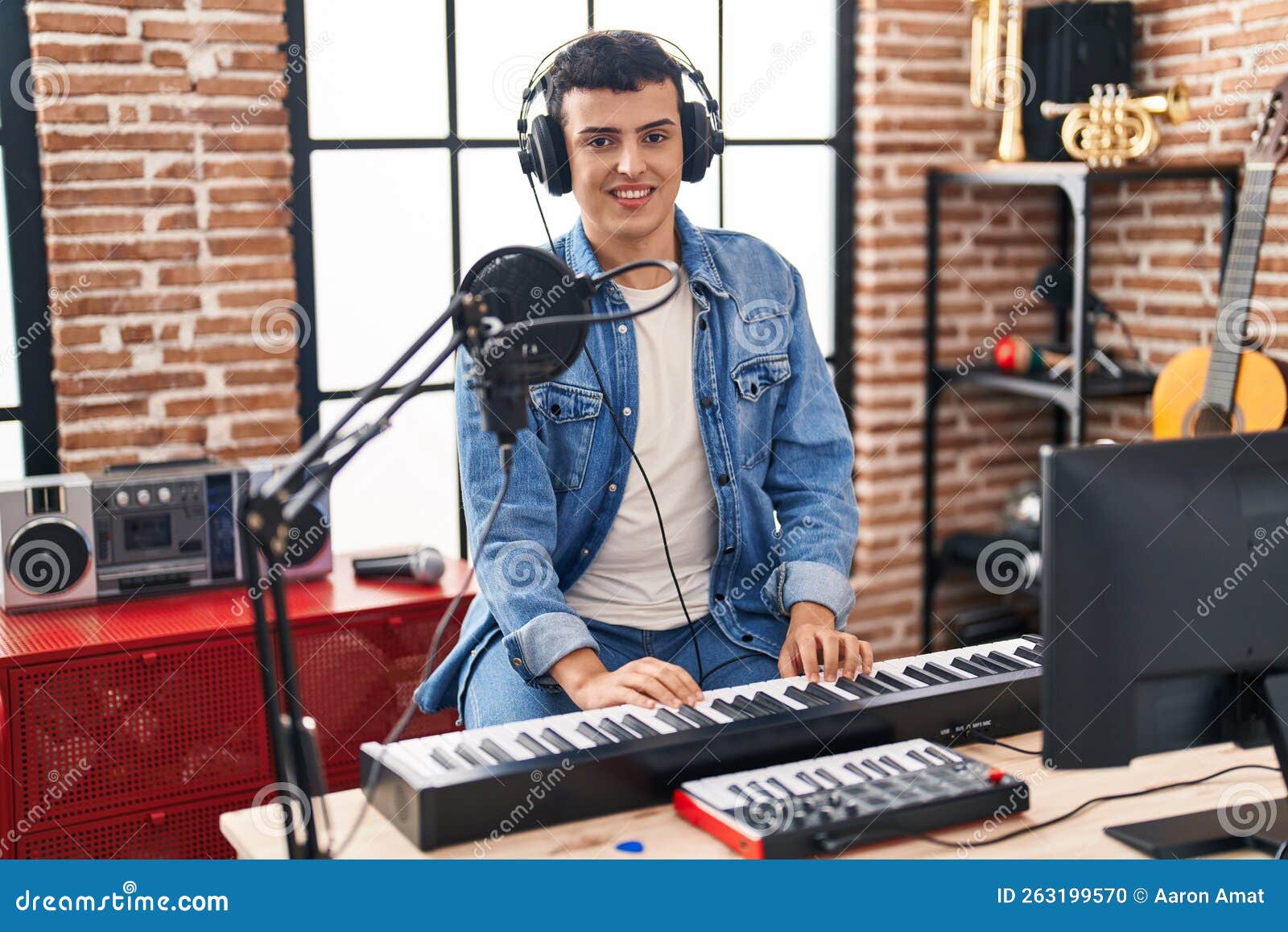 Young Non Binary Man Musician Singing Song Playing Piano Keyboard at ...