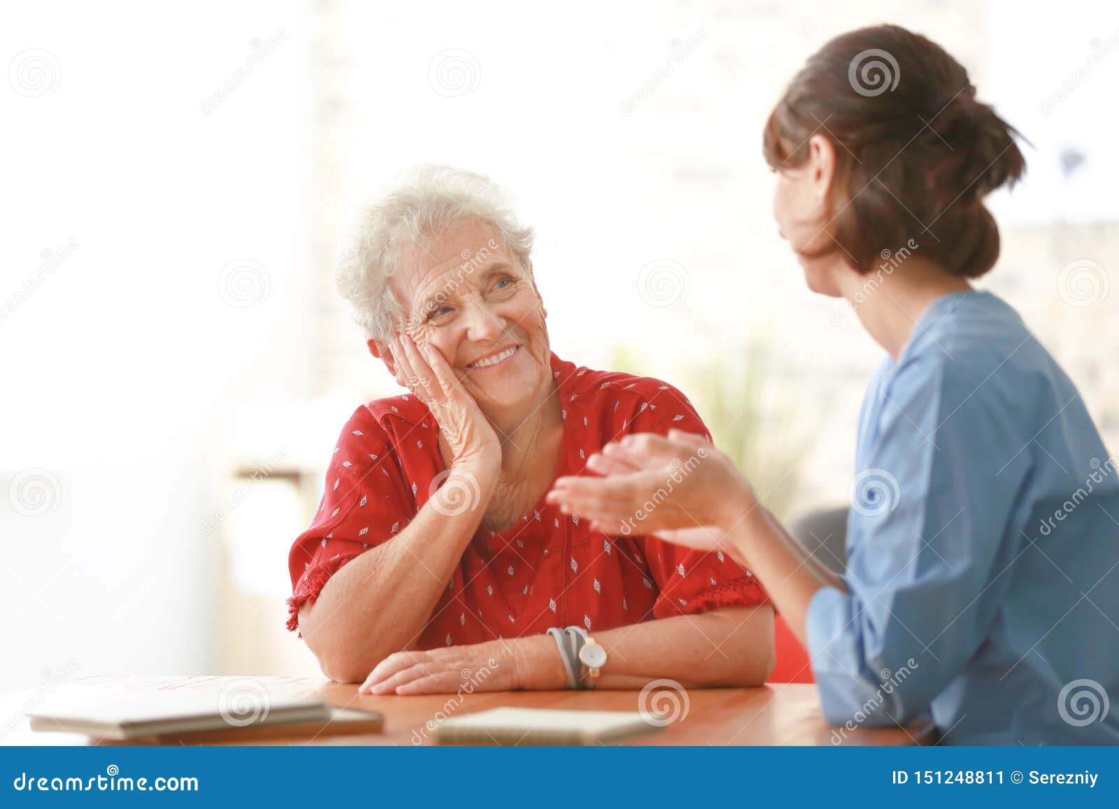 Young Nurse Visiting Elderly Woman at Home Stock Image - Image of ...