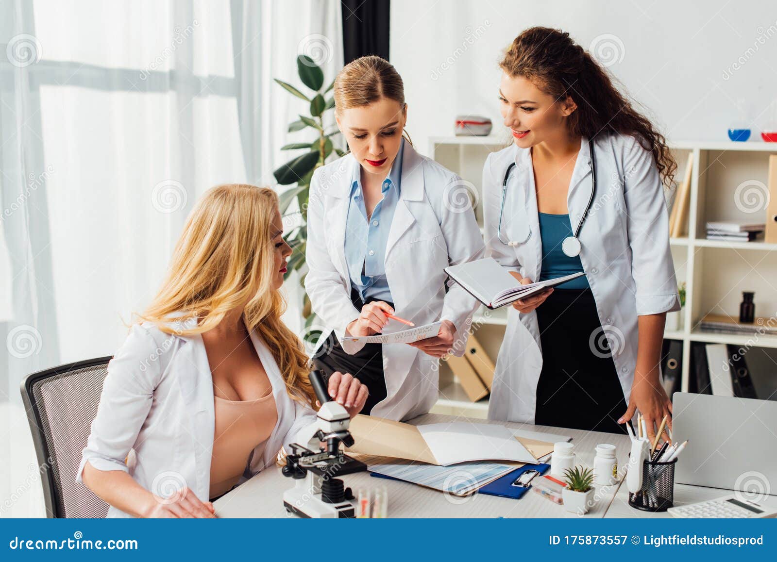 Young and Nurses Working Near Microscope Stock Image - Image of health ...