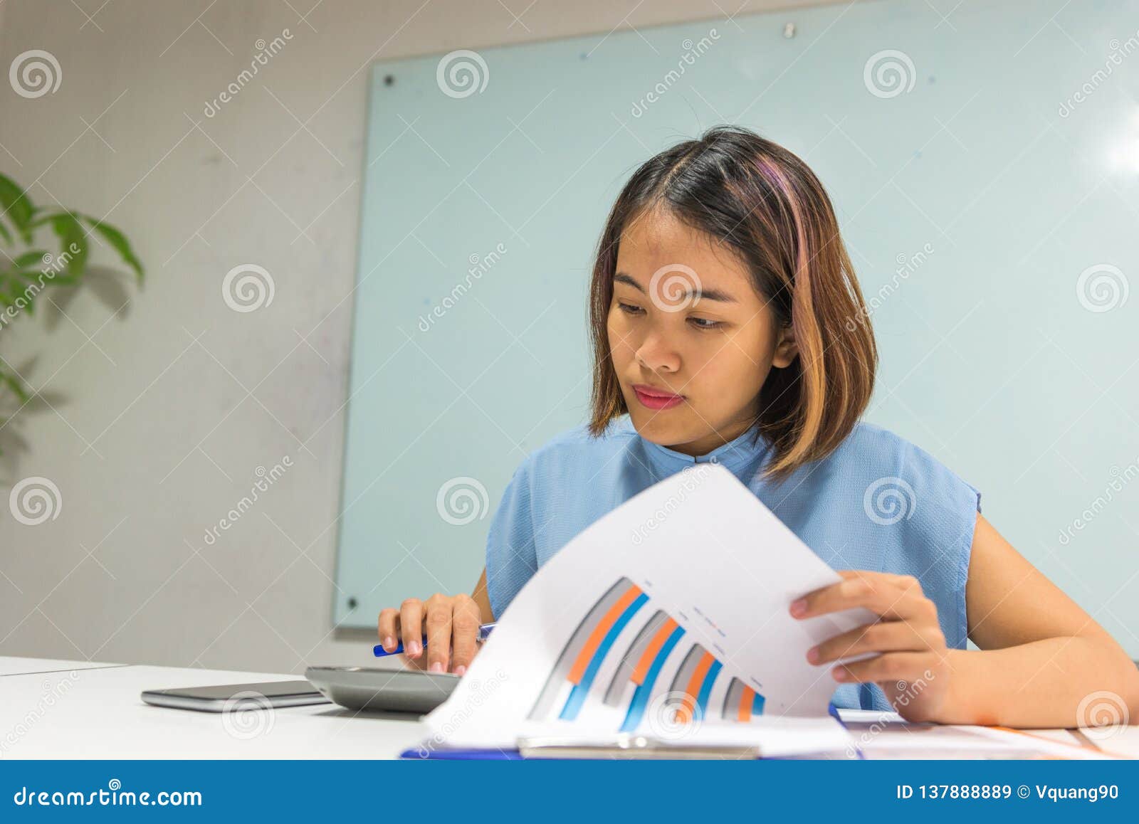 Young Office Lady Using Calculator To Check Financial Report Stock ...