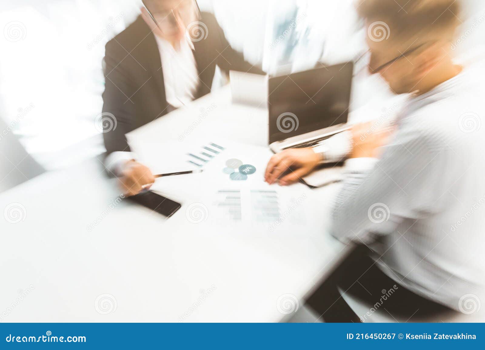 Young Office Worker Sitting at Desk, Using Computer. Two Business Man ...