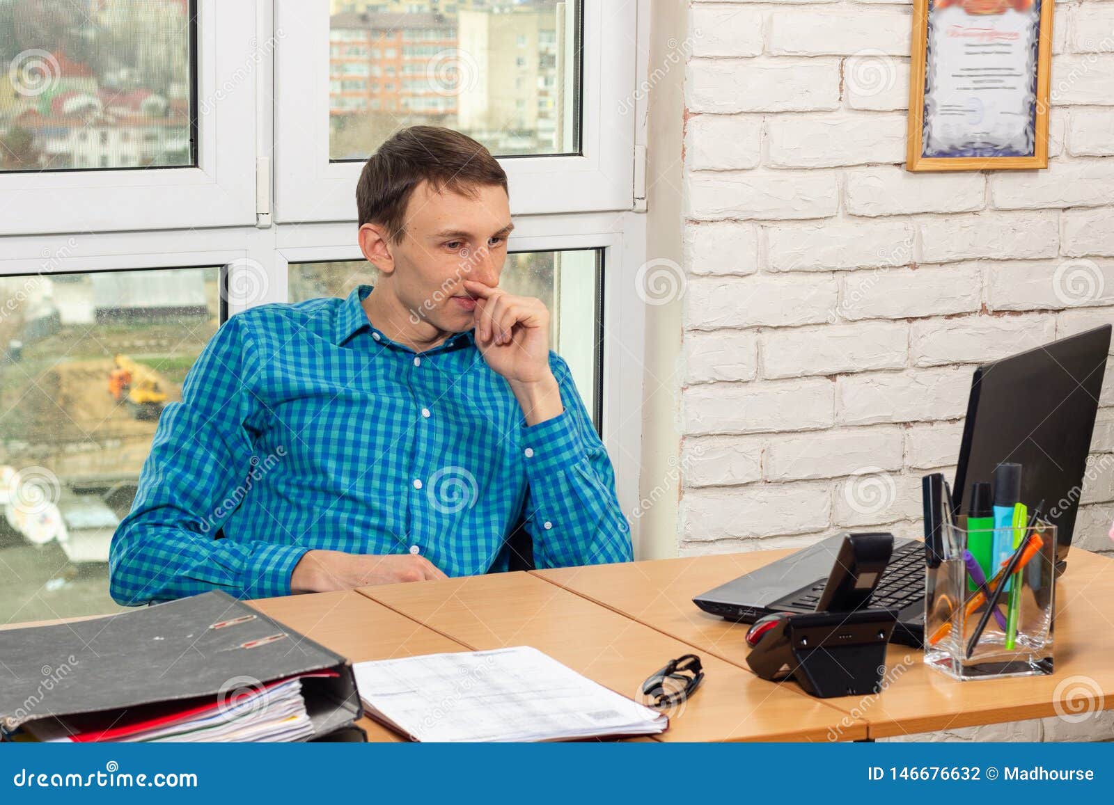 Young Office Worker Thinking in the Workplace Stock Photo - Image of ...
