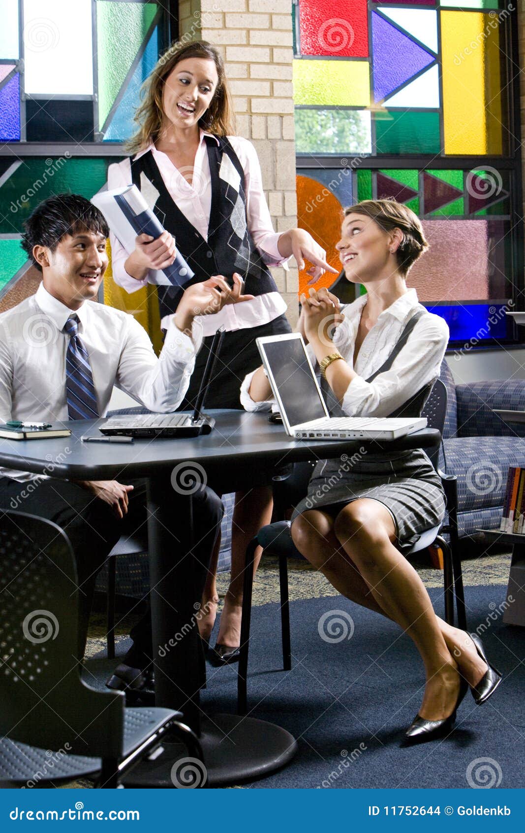 Young Office Workers in Colorful Meeting Room Stock Photo - Image of ...