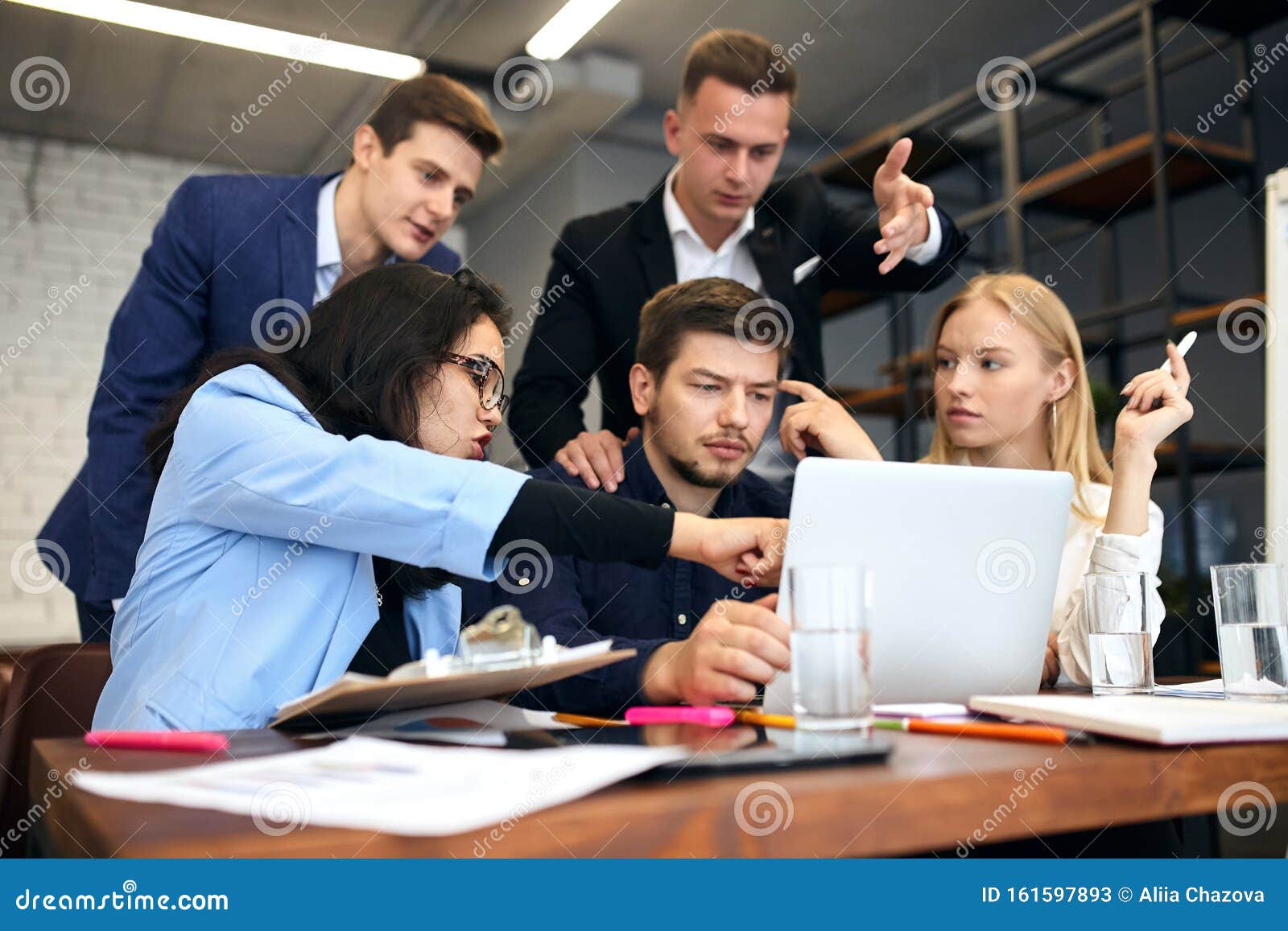 Young Office Workers Correcting the Document Stock Image - Image of ...
