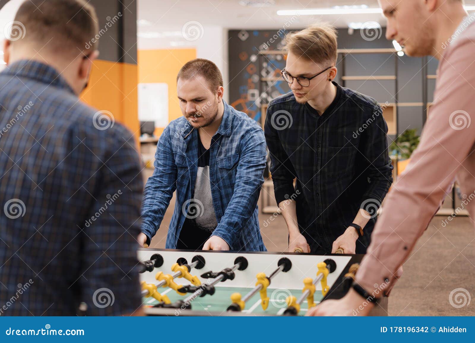 Young Office Workers Playing Table Soccer Stock Photo - Image of ...