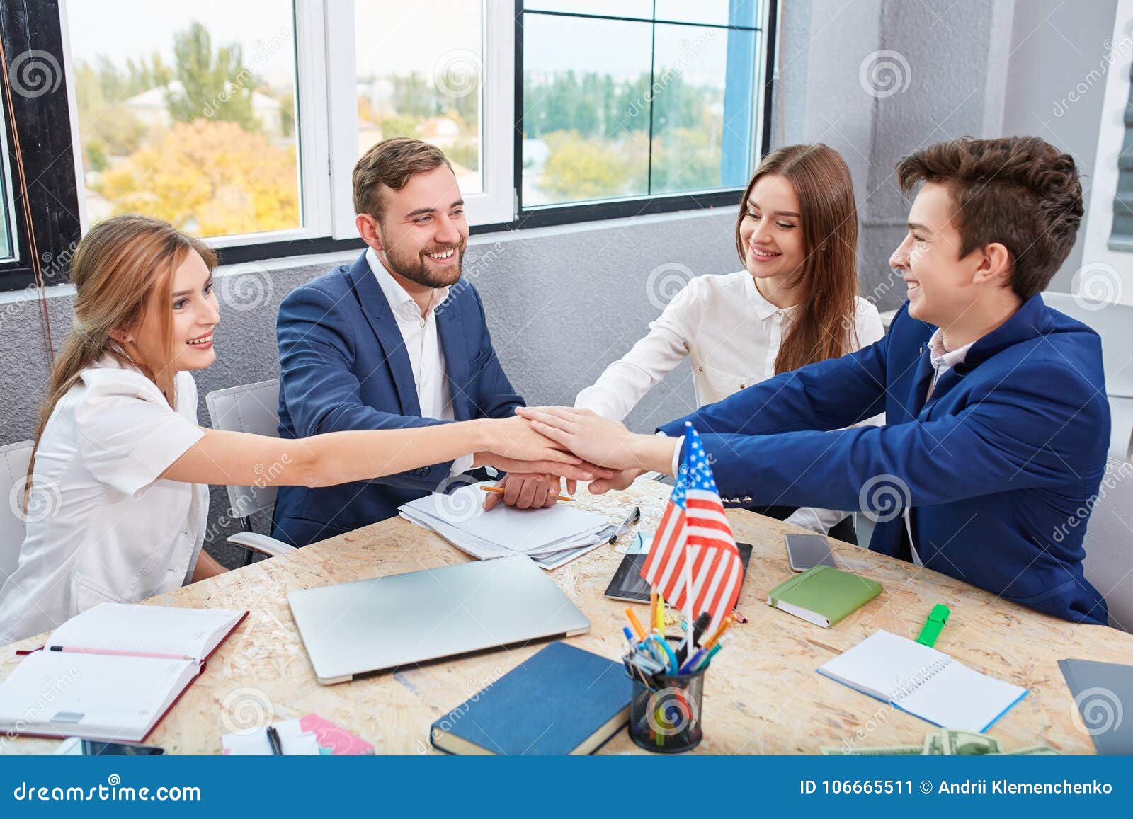 Office Workers Shake Hands at the Same Time. the Concept of Office Work ...