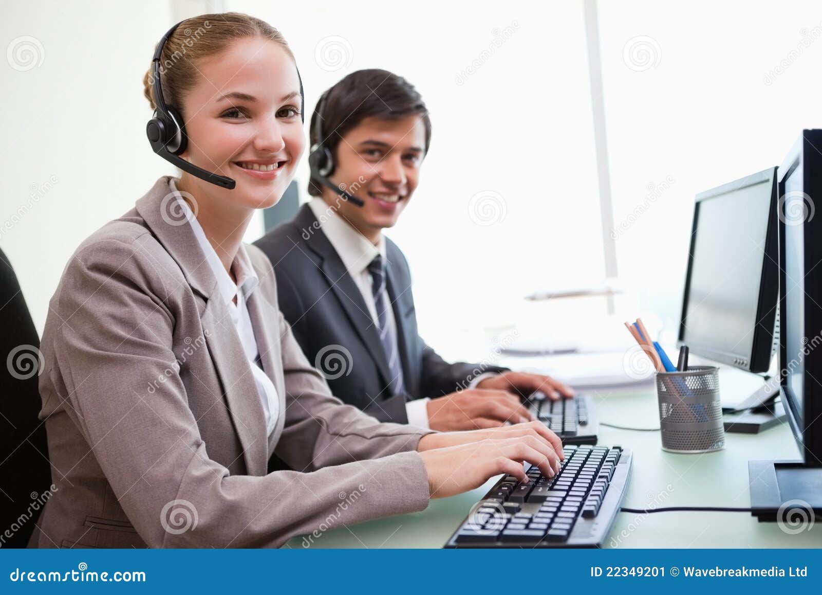 Young Office Workers Using Computers Stock Image - Image of ...