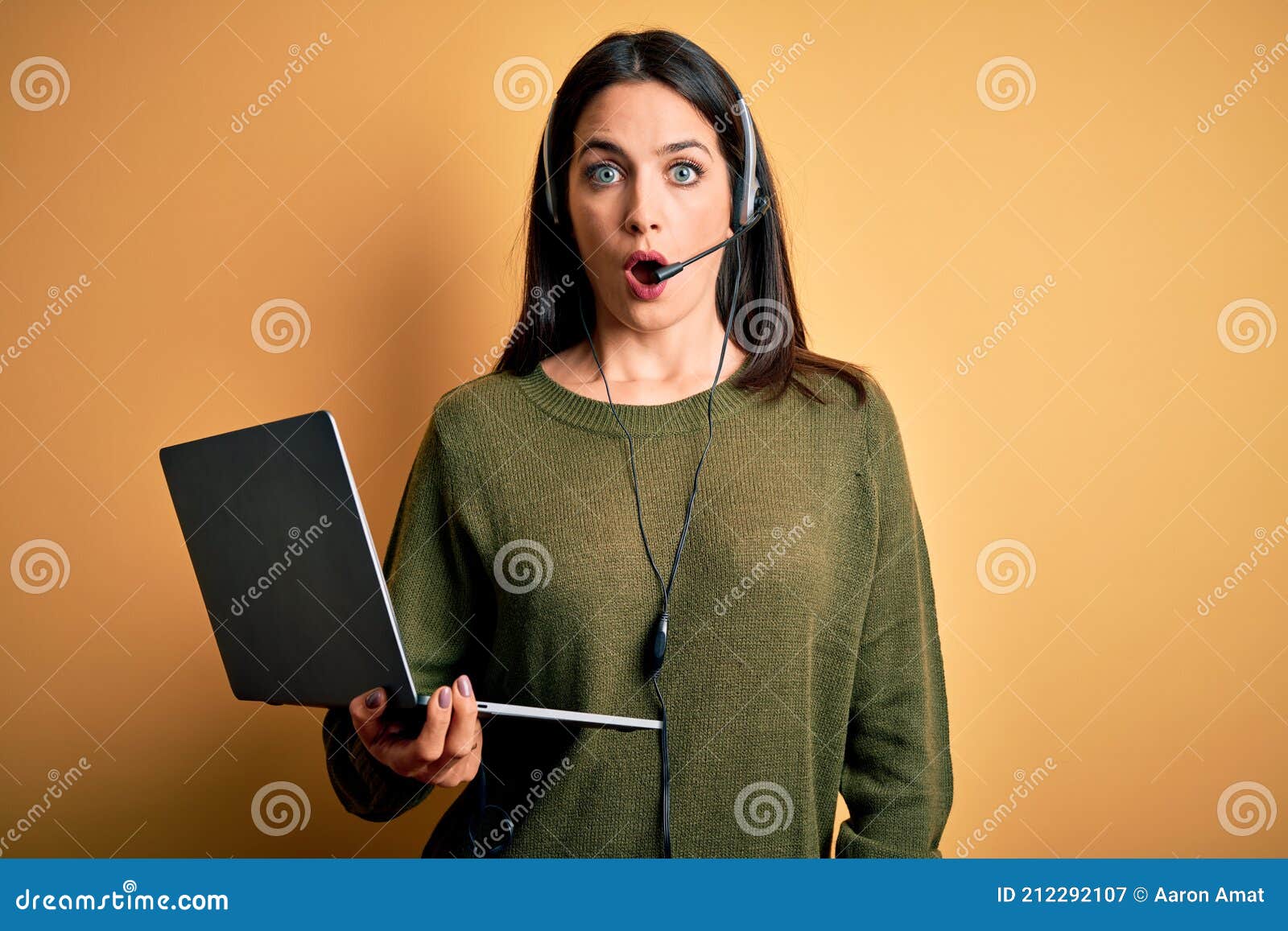 Young Operator Woman with Blue Eyes Working on Call Center Using ...