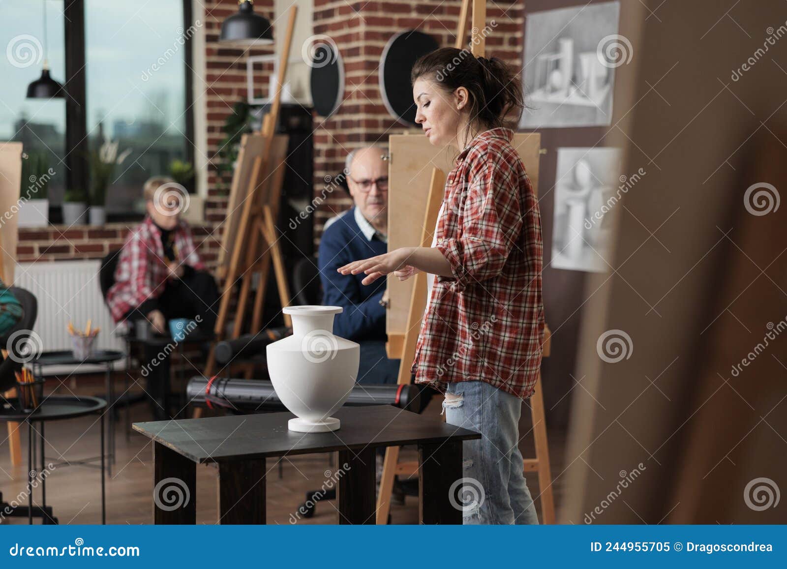 Young Painter Teacher Supervising Art Class Explaining Graphic ...