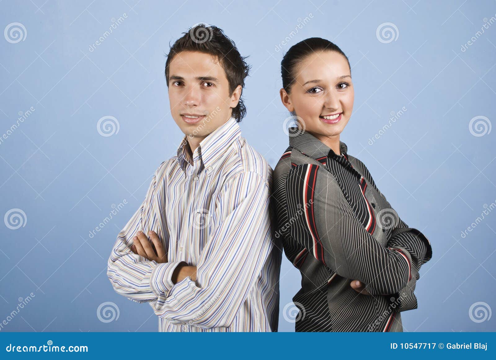 Young Pair Of Business People Smiling Stock Image - Image: 10547717
