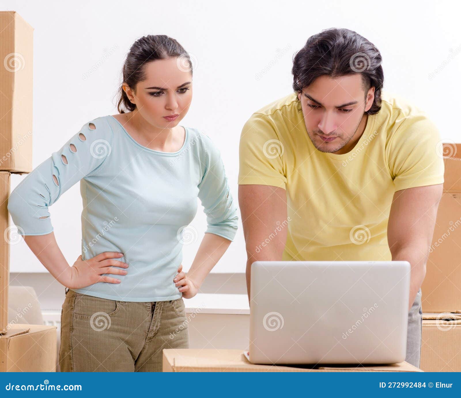 Young Pair Moving To New Apaprtment Stock Photo - Image of package ...