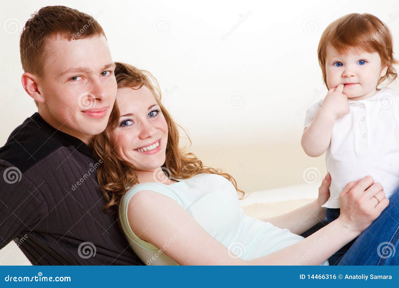 Young parents and baby stock photo. Image of loving, charming - 14466316