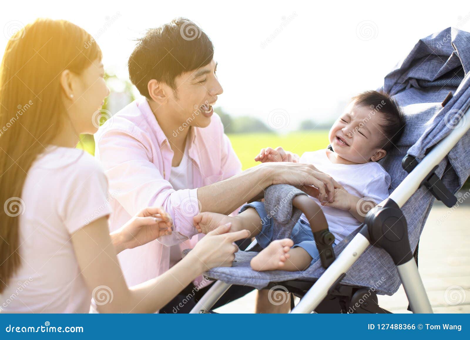 Young Parents with Baby Crying in the Carriage Stock Photo - Image of ...