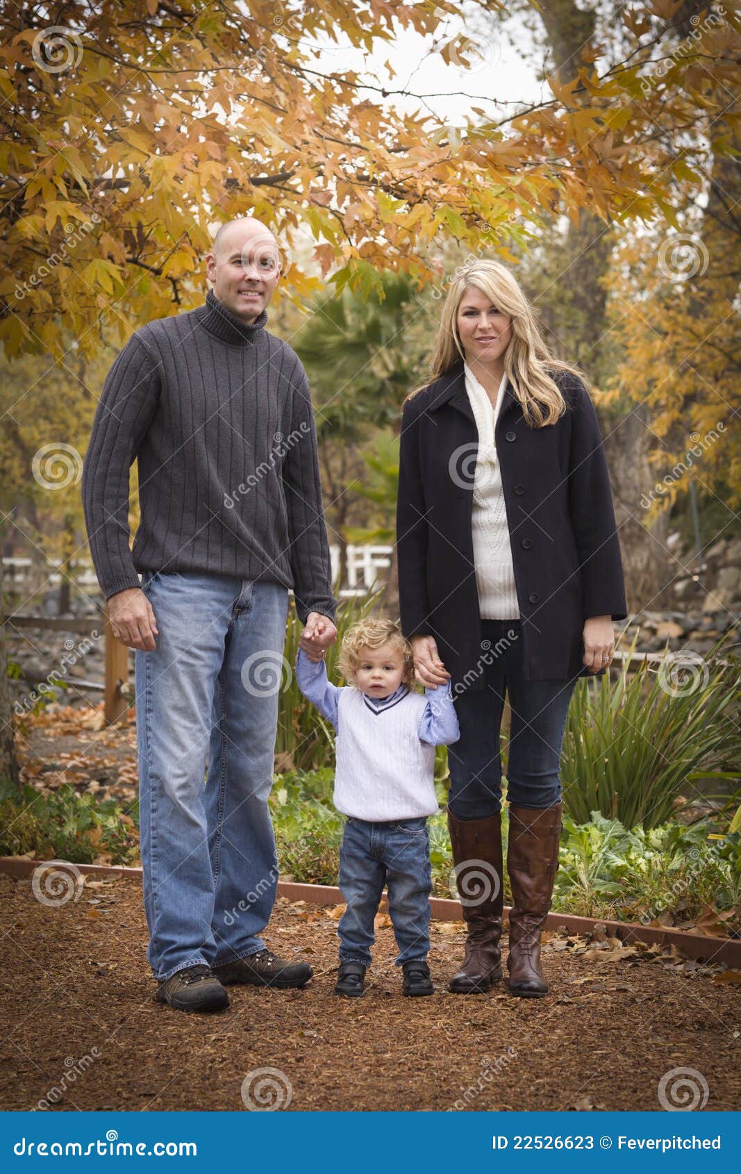 Young Parents and Child Portrait in Park Stock Image - Image of family ...