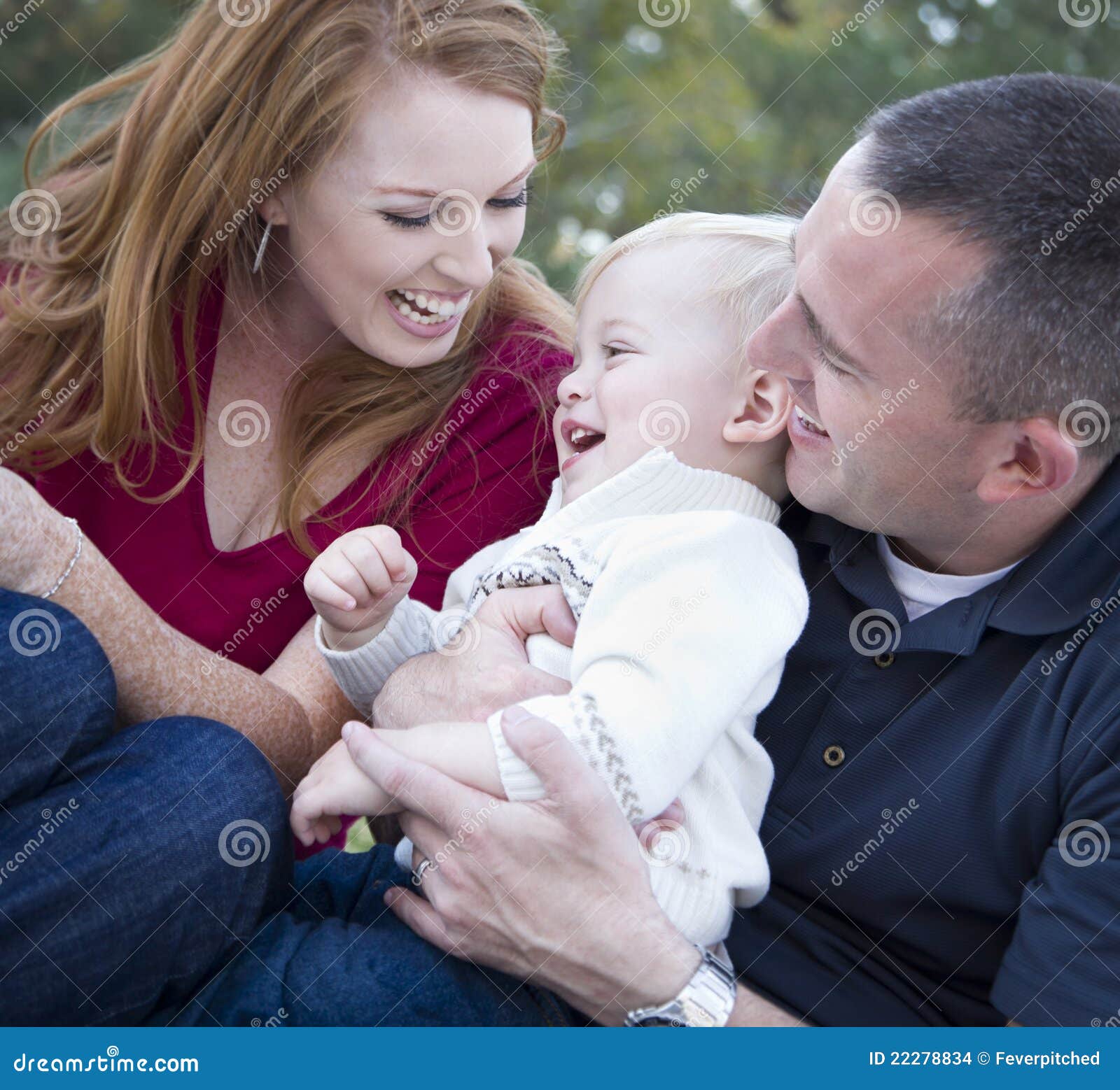 Young Parents Laughing with Child Boy in Park Stock Photo - Image of ...