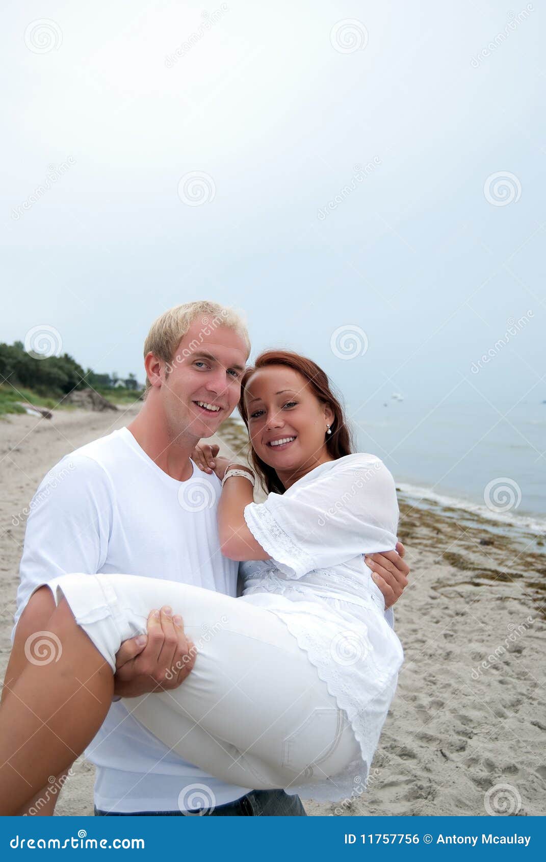 Young Partners Having Fun by the Beach Stock Photo - Image of laughing ...