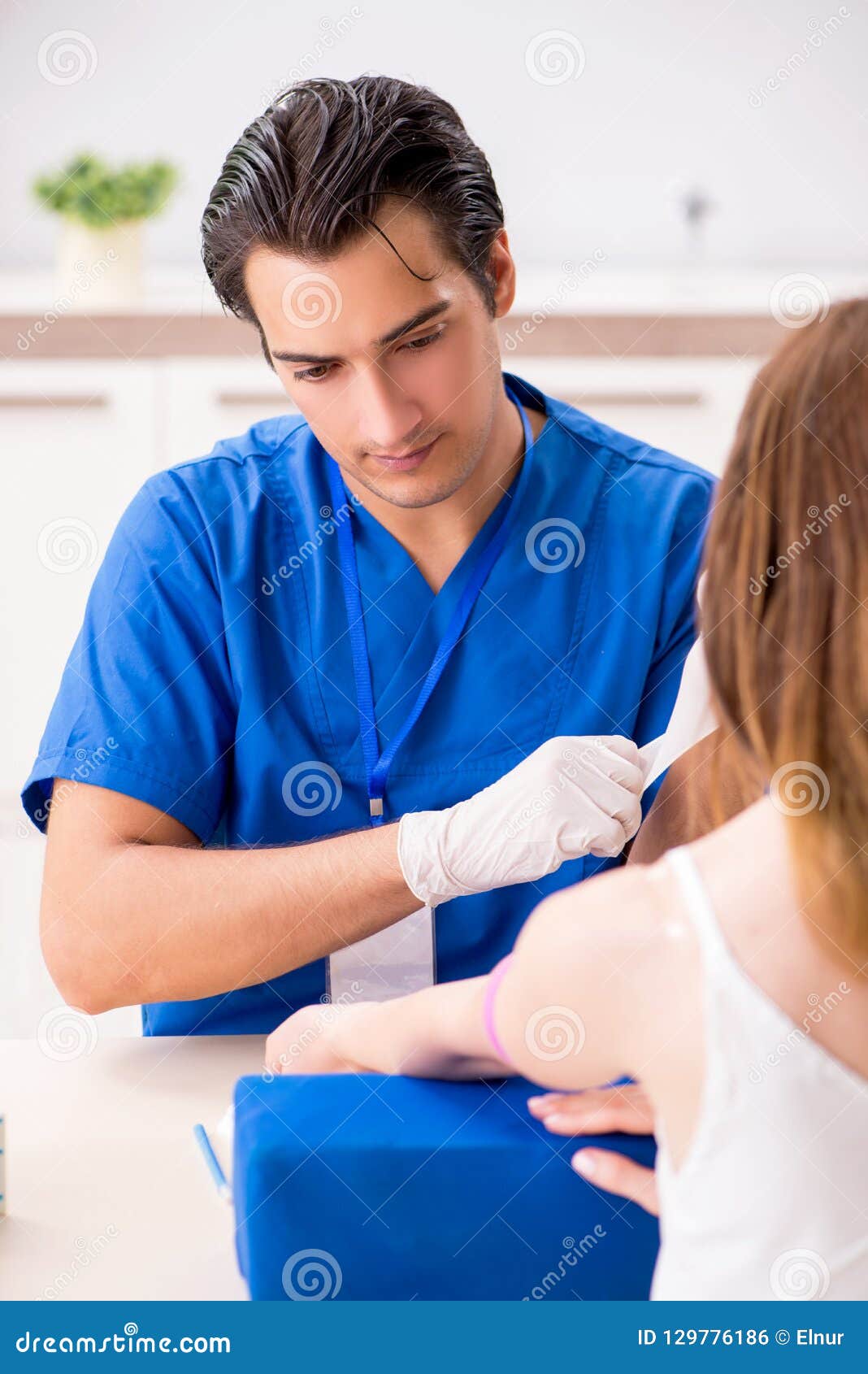 The Young Patient during Blood Test Sampling Procedure Stock Photo ...