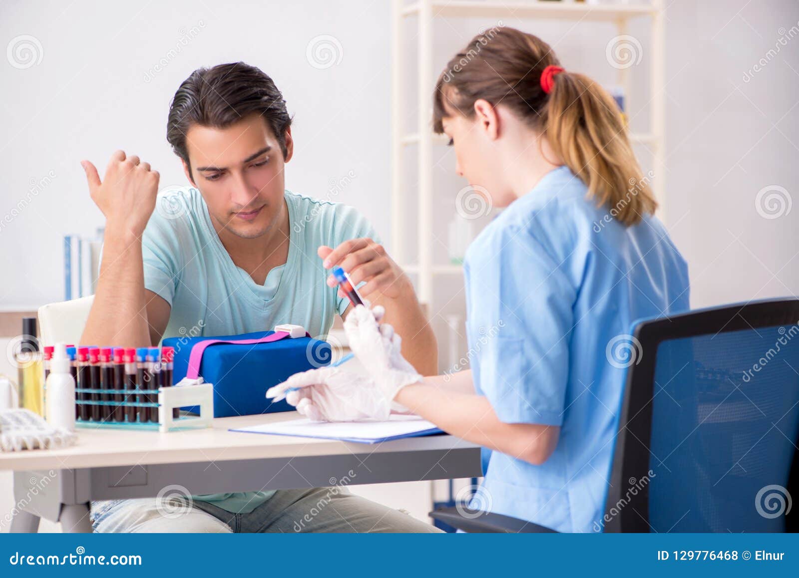 The Young Patient during Blood Test Sampling Procedure Stock Photo ...