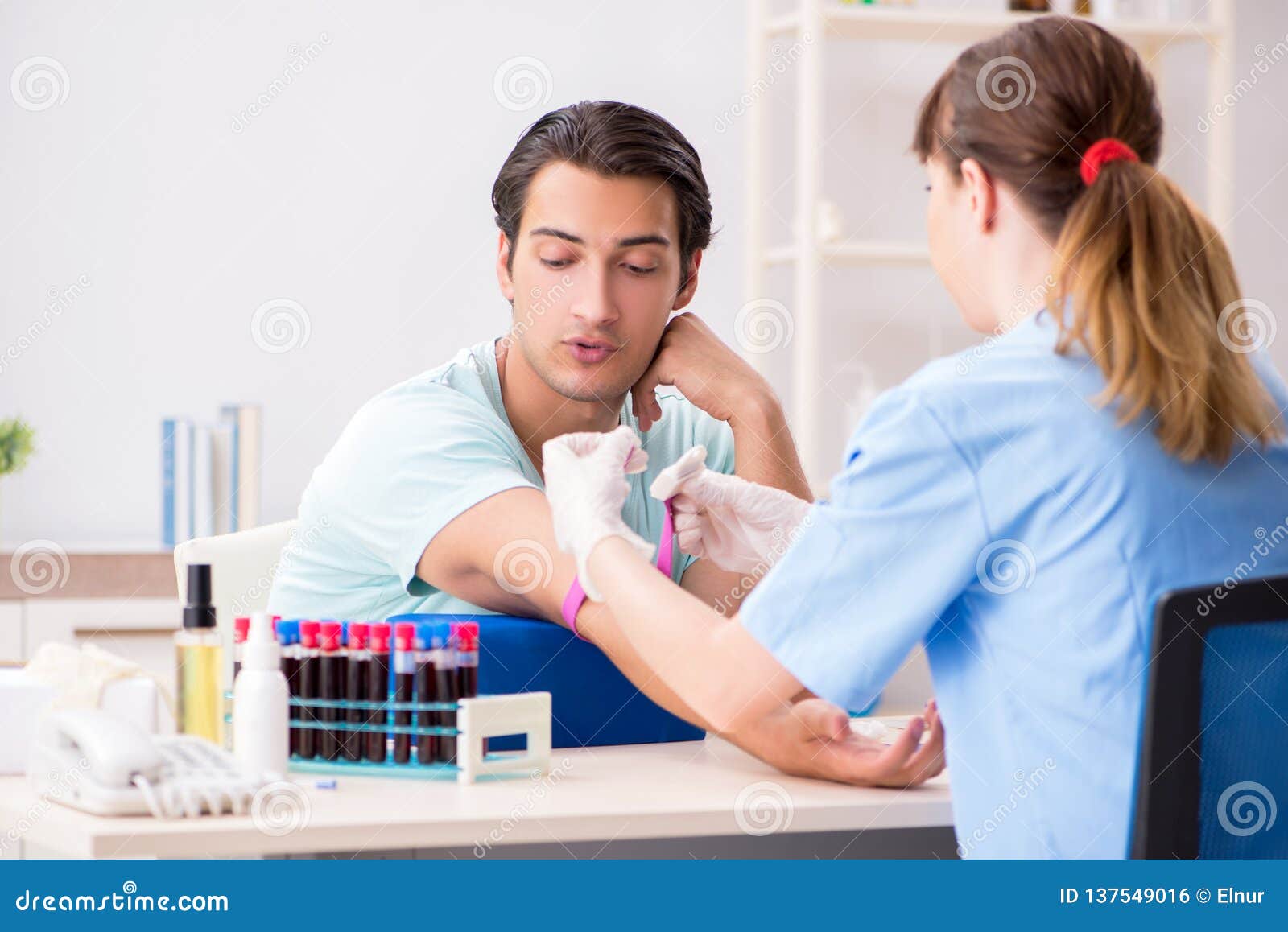 The Young Patient during Blood Test Sampling Procedure Stock Photo ...