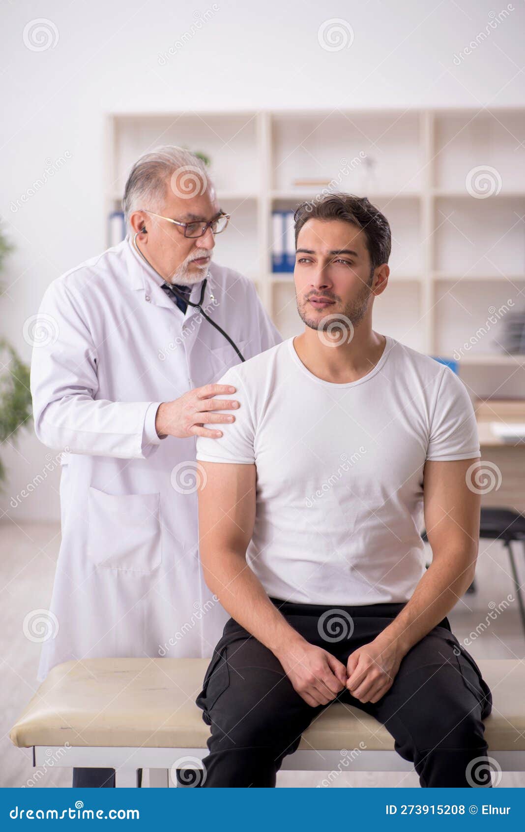 Young Male Patient Visiting Old Male Doctor Stock Photo - Image of ...