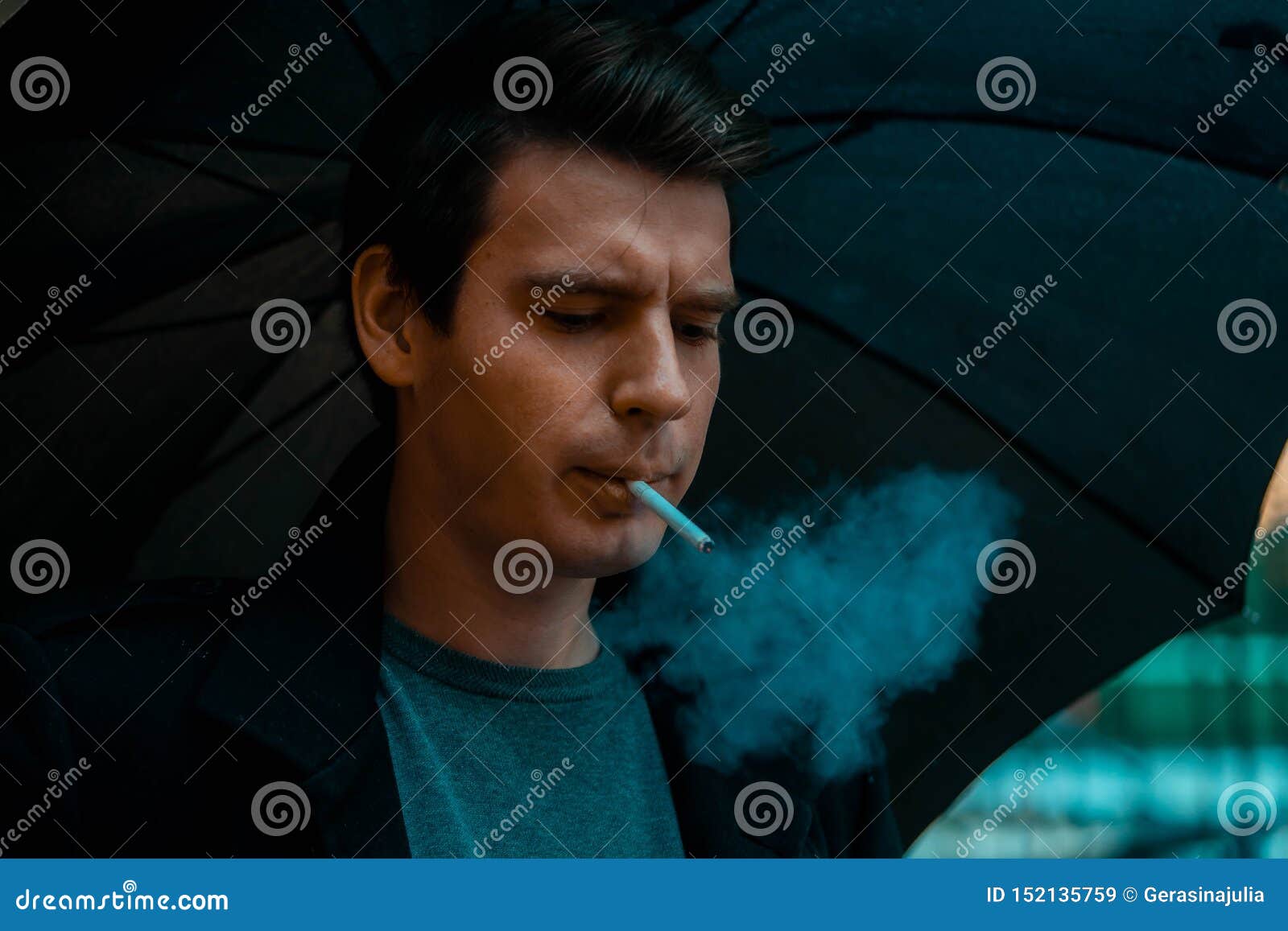 Young Pensive Handsome Man with Umbrella on Rainy Day Walking in Park ... Young Pensive Handsome Man with Umbrella on Rainy Day Walking in Park ...
