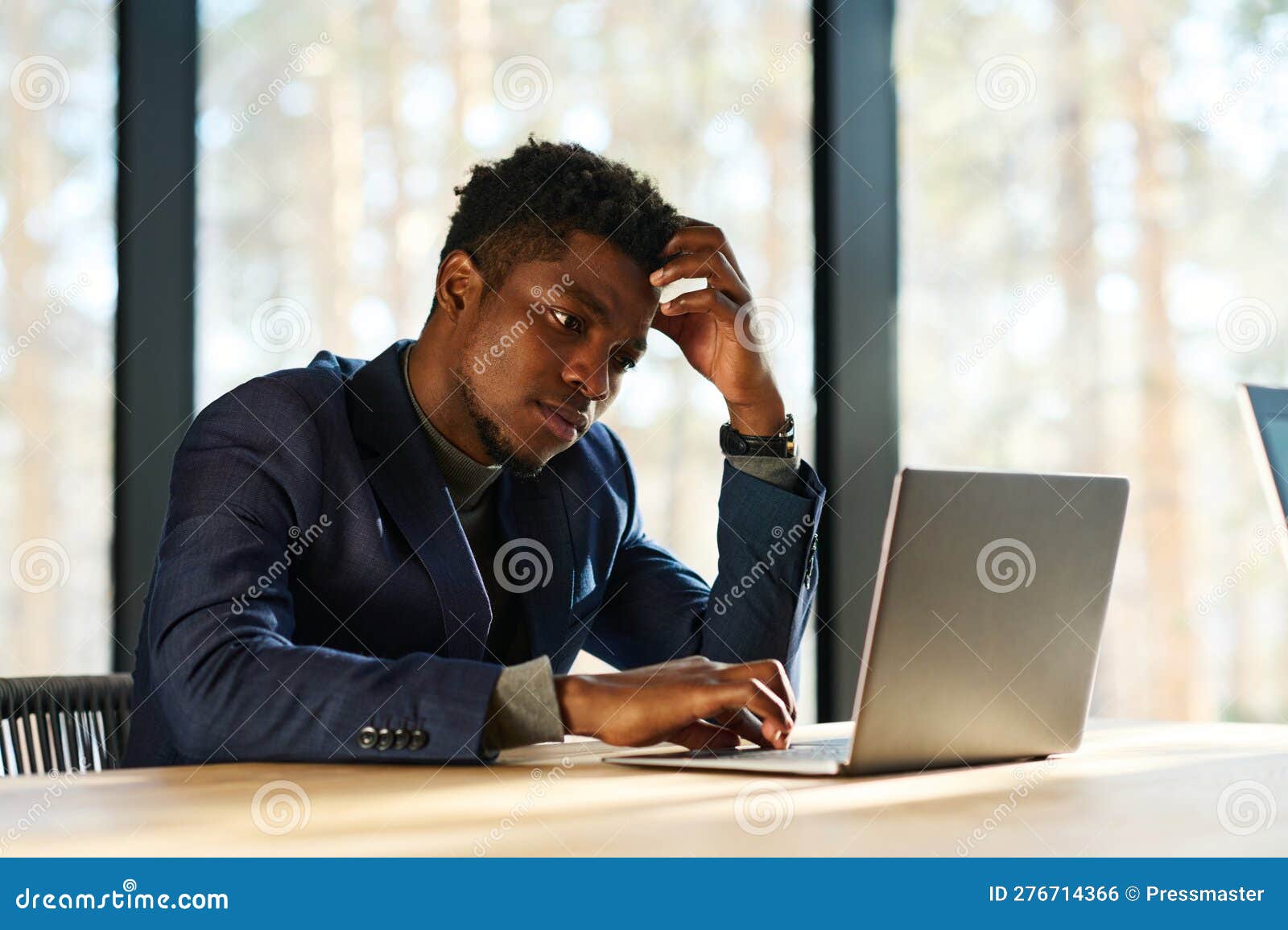 Young Pensive or Tense Businessman Sitting in Front of Laptop Stock ...