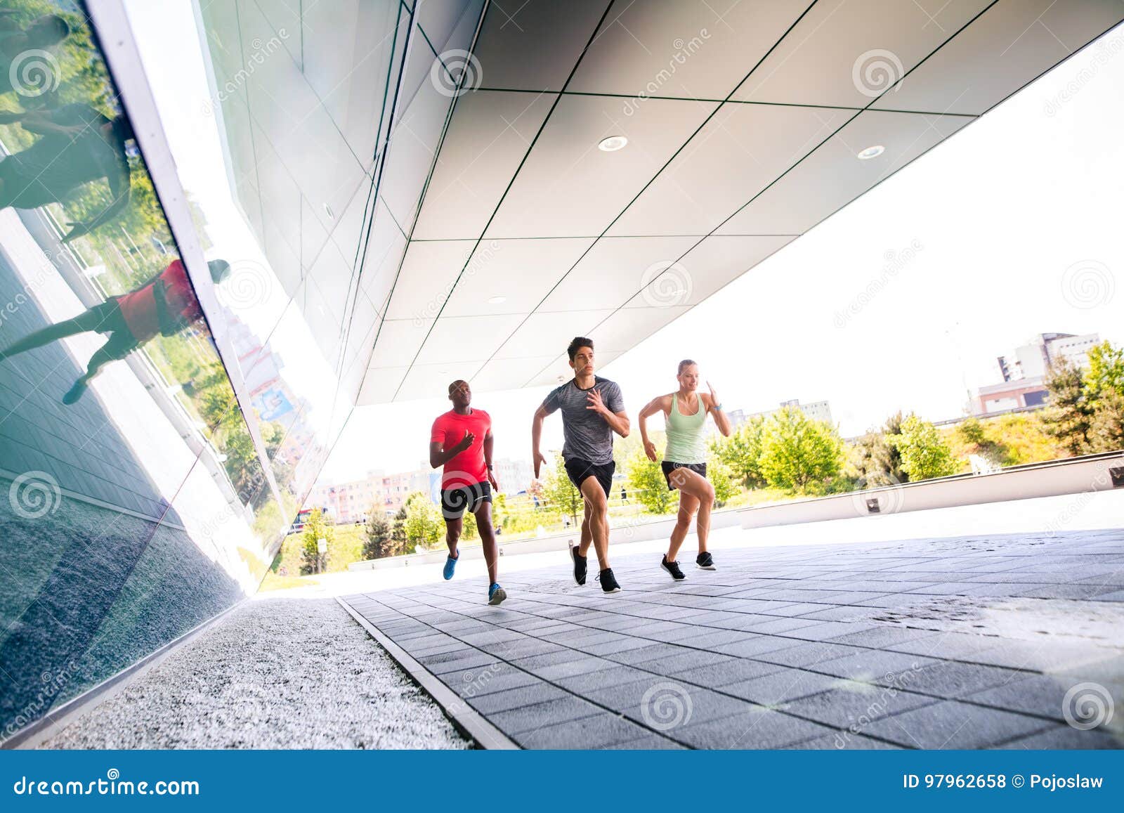 Young People in the City Running Together. Stock Photo - Image of ...